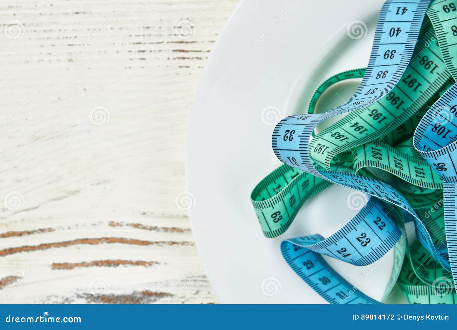 Measuring tape on a plate. stock photo. Image of measure - 89814172