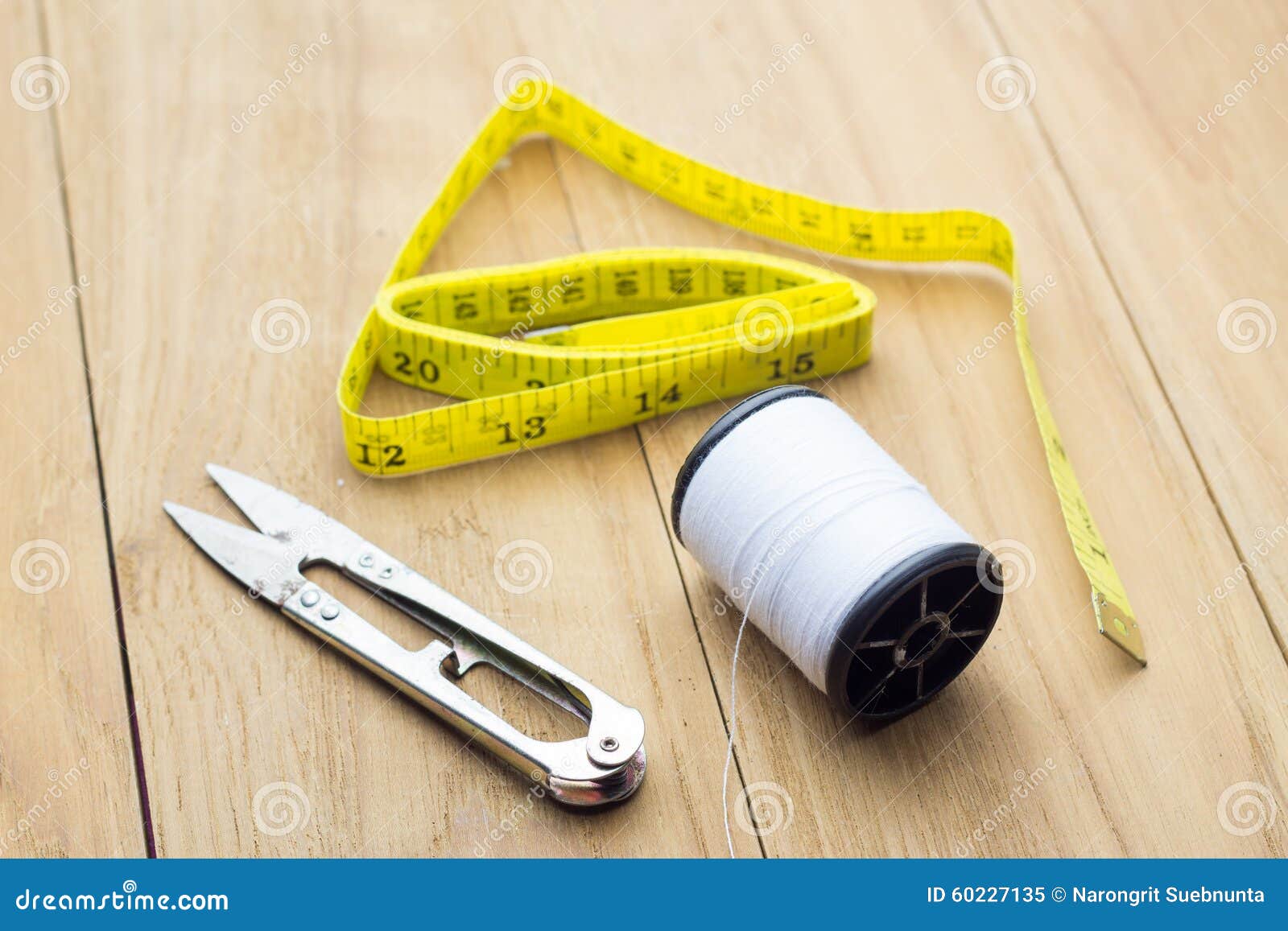 Measuring Tape Scissor and Thread on Wooden Board Stock Image - Image ...