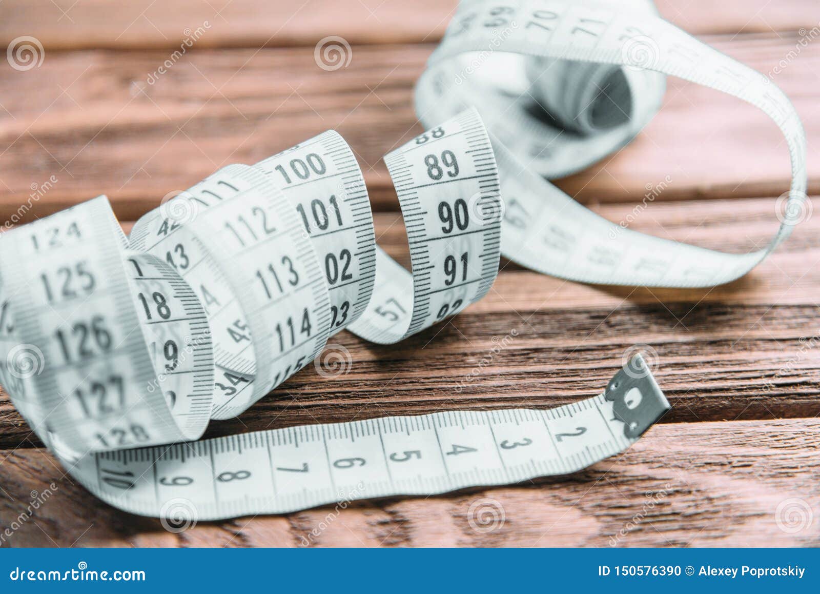 Measuring Tape on a Wooden Table. Stock Photo - Image of measuring ...