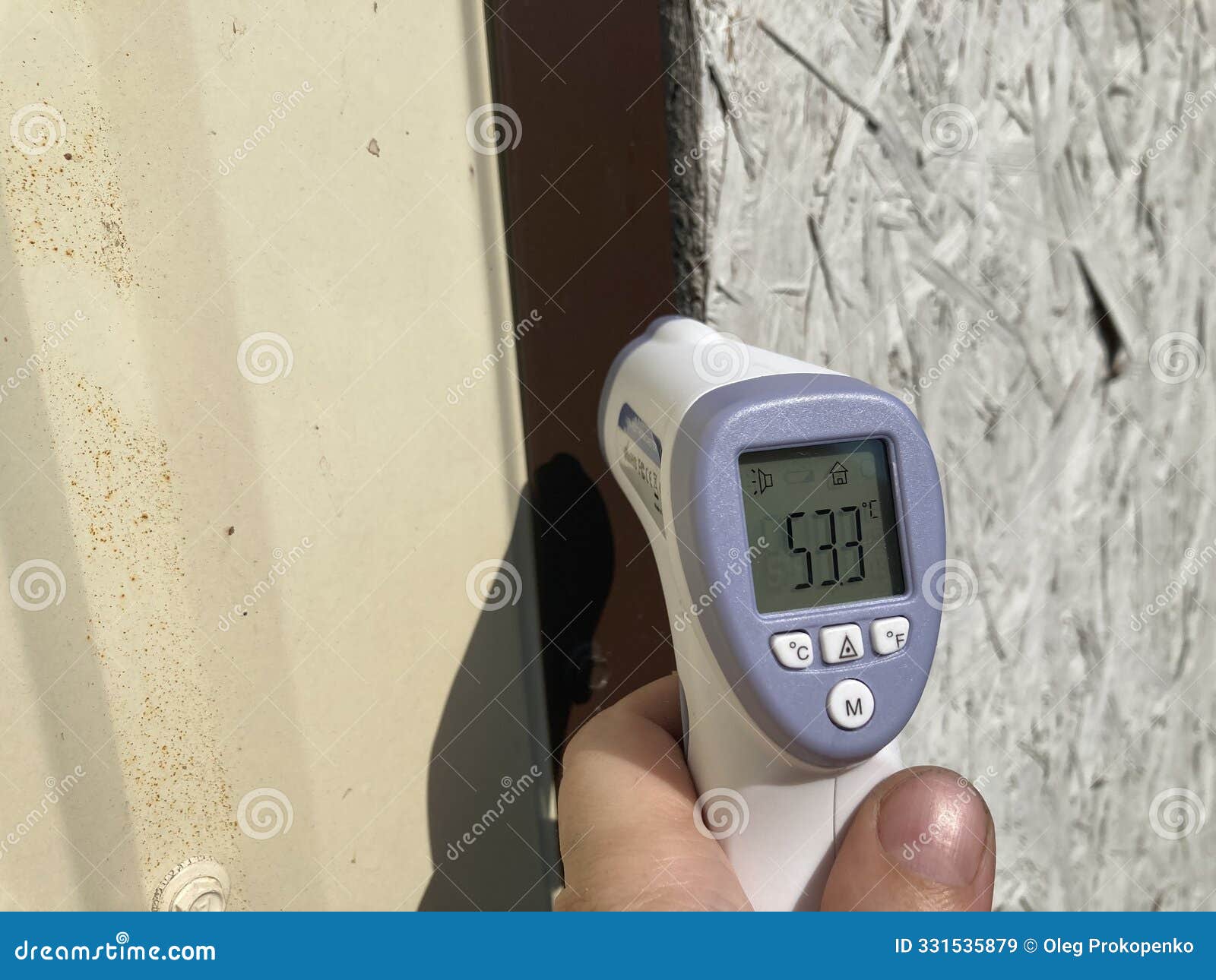 Measuring Temperature with a Non-contact Thermometer Stock Image ...