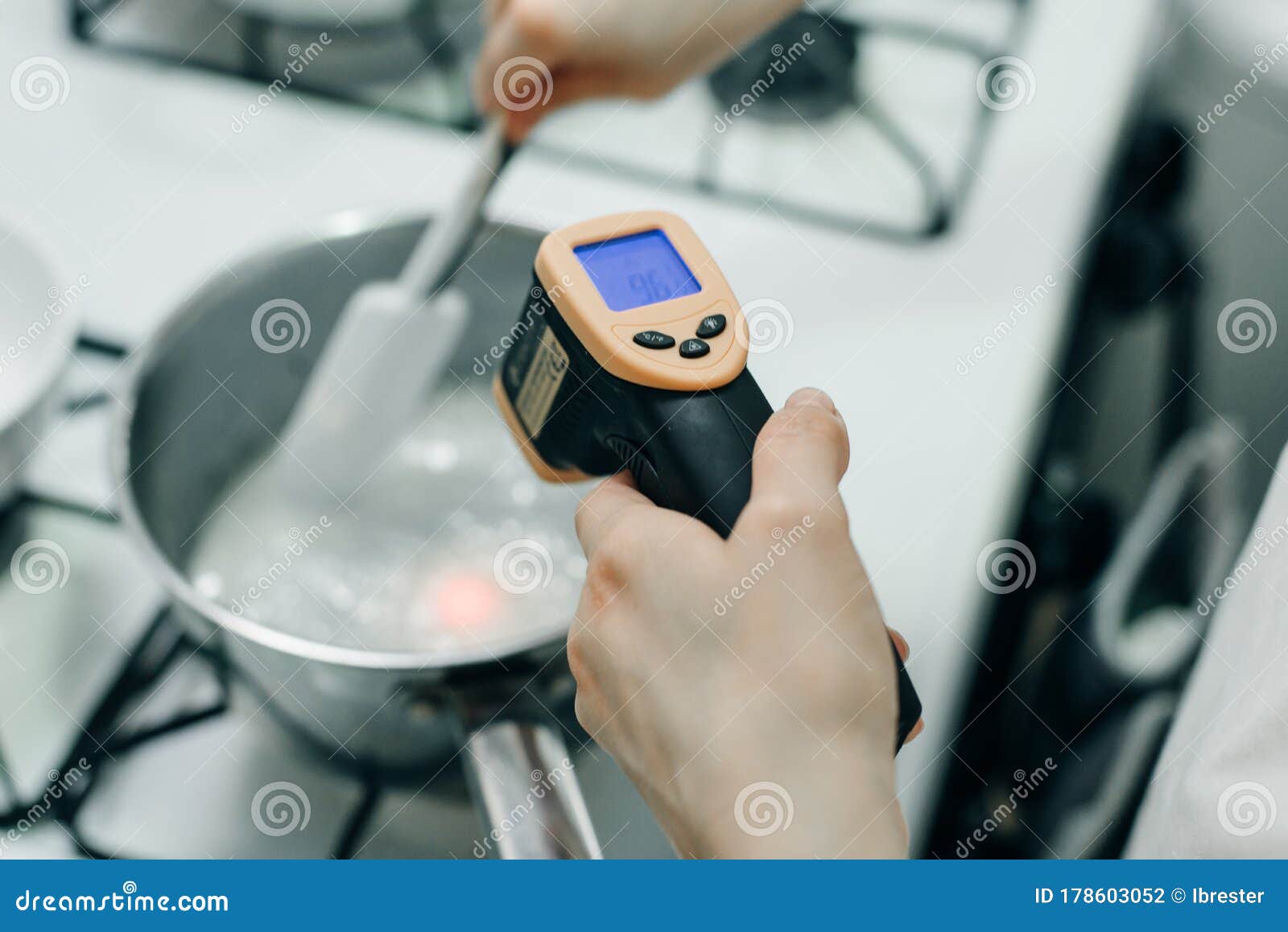 Measuring the Temperature of Water by Digital Thermometer Stock Photo ...