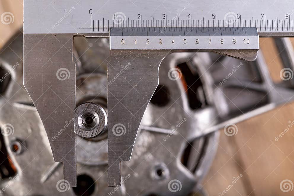 Measuring the Thread with an Analog Caliper. Measurement Work in the ...