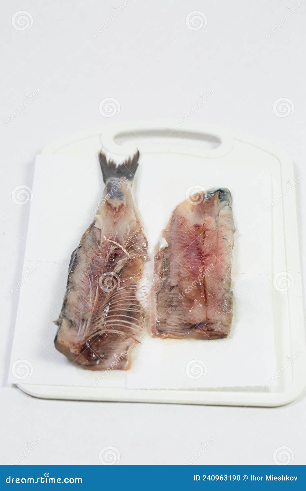 Meat and Bones of Fresh Herring for a Delicious Dish, Carve Fish Stock ...