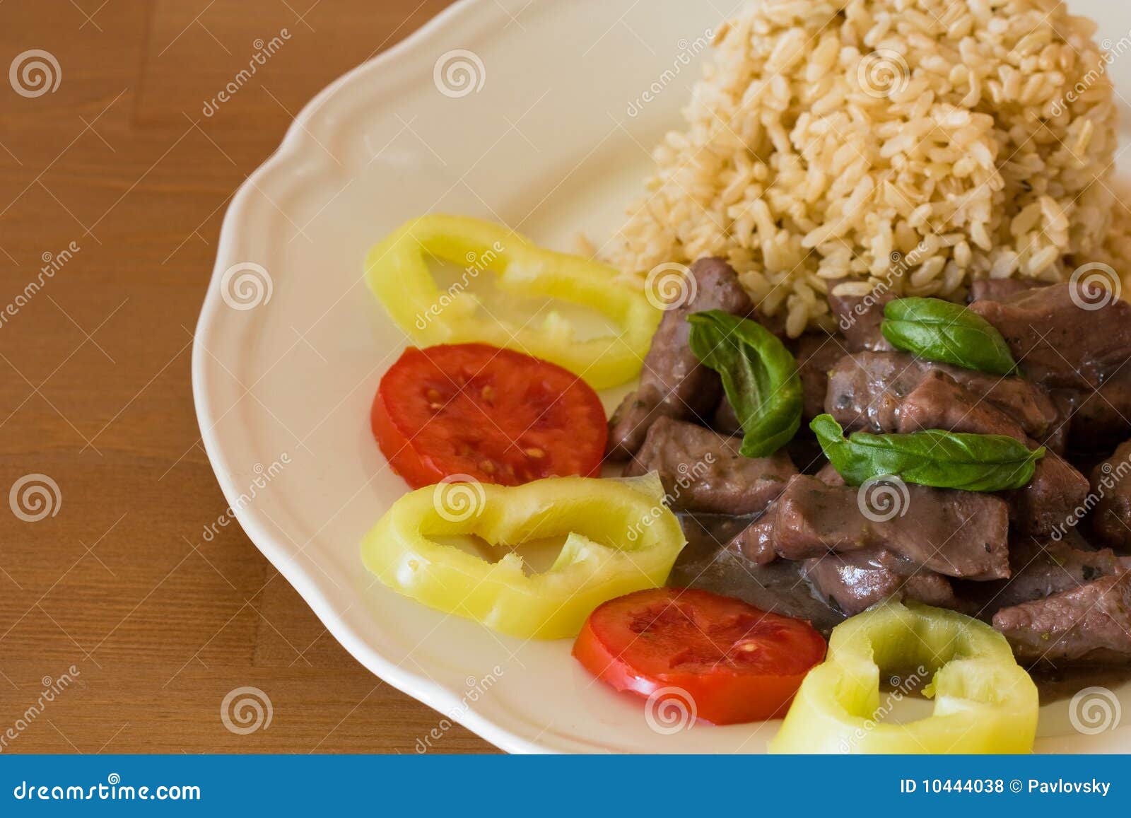 Meat with Brown Rice and Garnish Stock Photo - Image of home, sauce ...