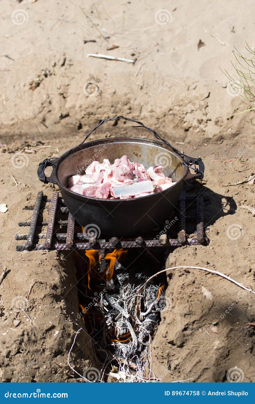 Meat in a cauldron on fire stock photo. Image of picnic - 89674758
