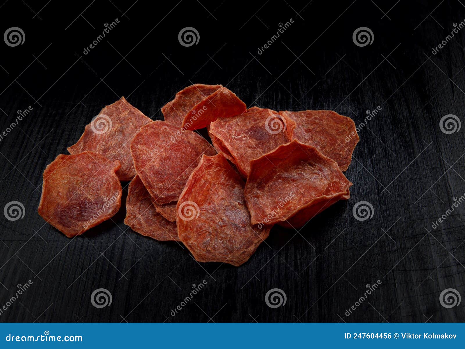 Meat Chips on a Black Background. Beautiful Placer of Thin Slices of ...