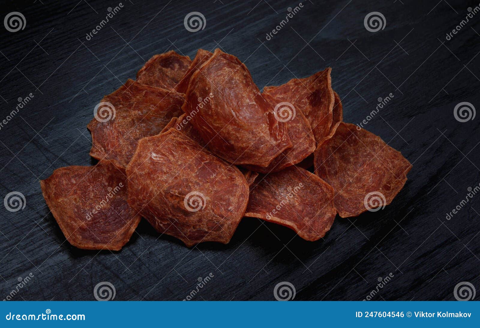 Meat Chips on a Black Background. Beautiful Placer of Thin Slices of ...