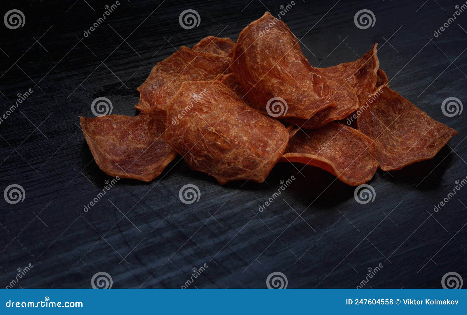 Meat Chips on a Black Background. Beautiful Placer of Thin Slices of ...