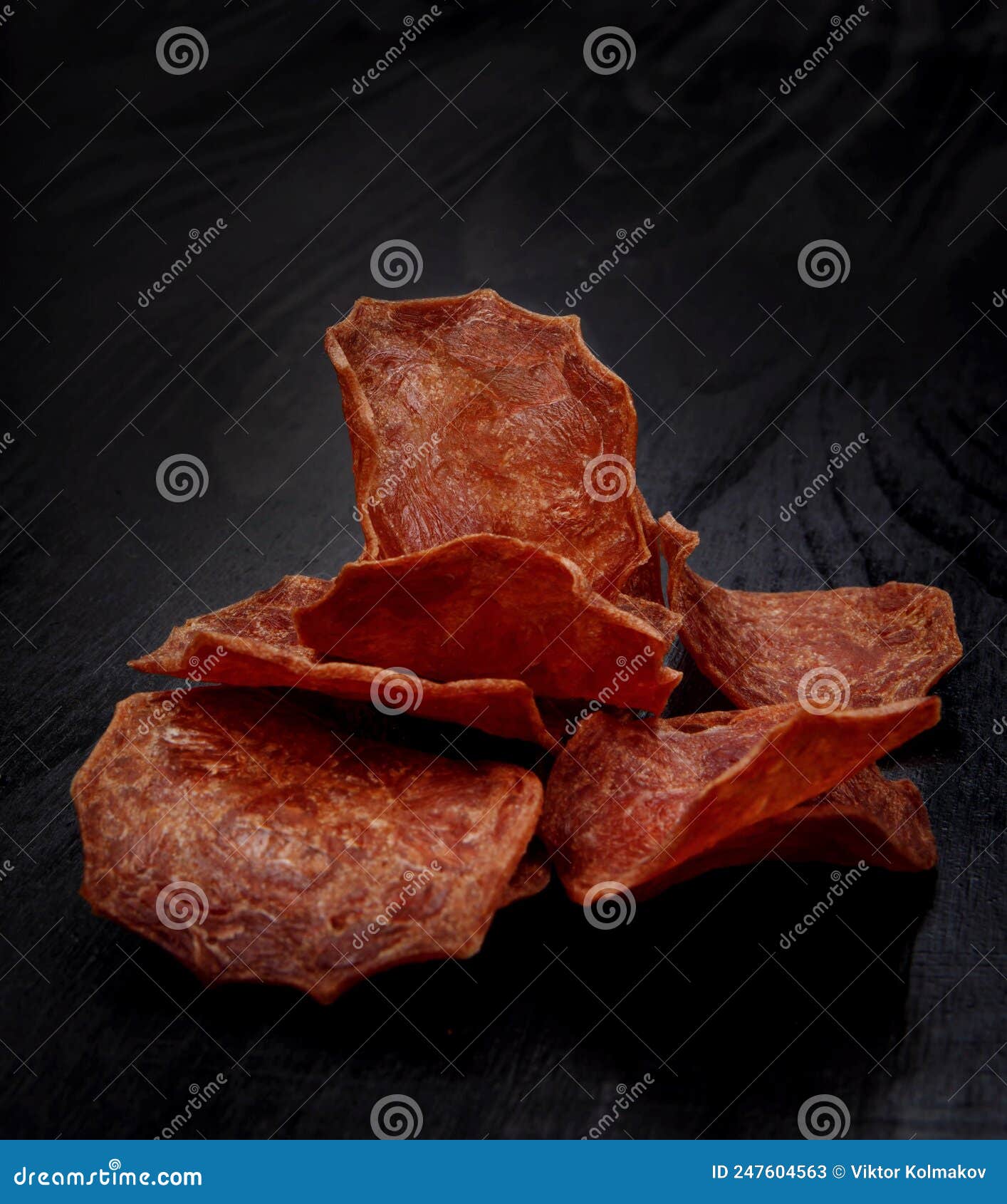 Meat Chips on a Black Background. Beautiful Placer of Thin Slices of ...