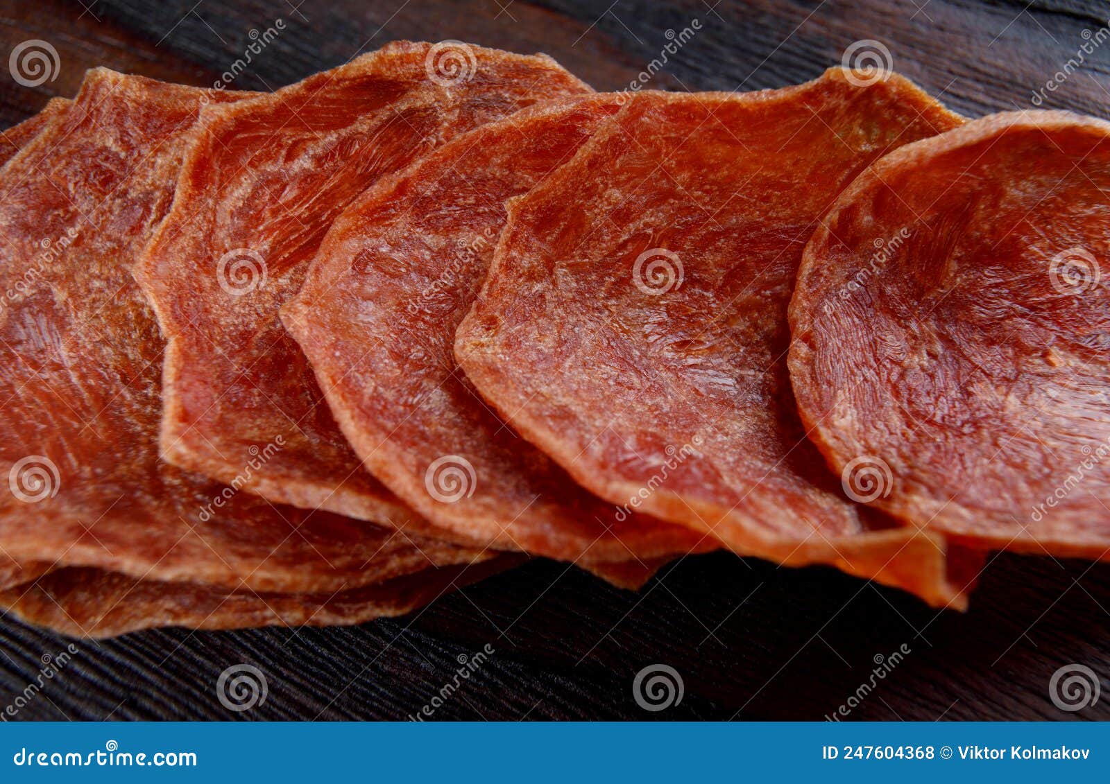 Meat Chips are Laid Out in a Row. Thin Pieces of Dried Meat Stock Photo ...