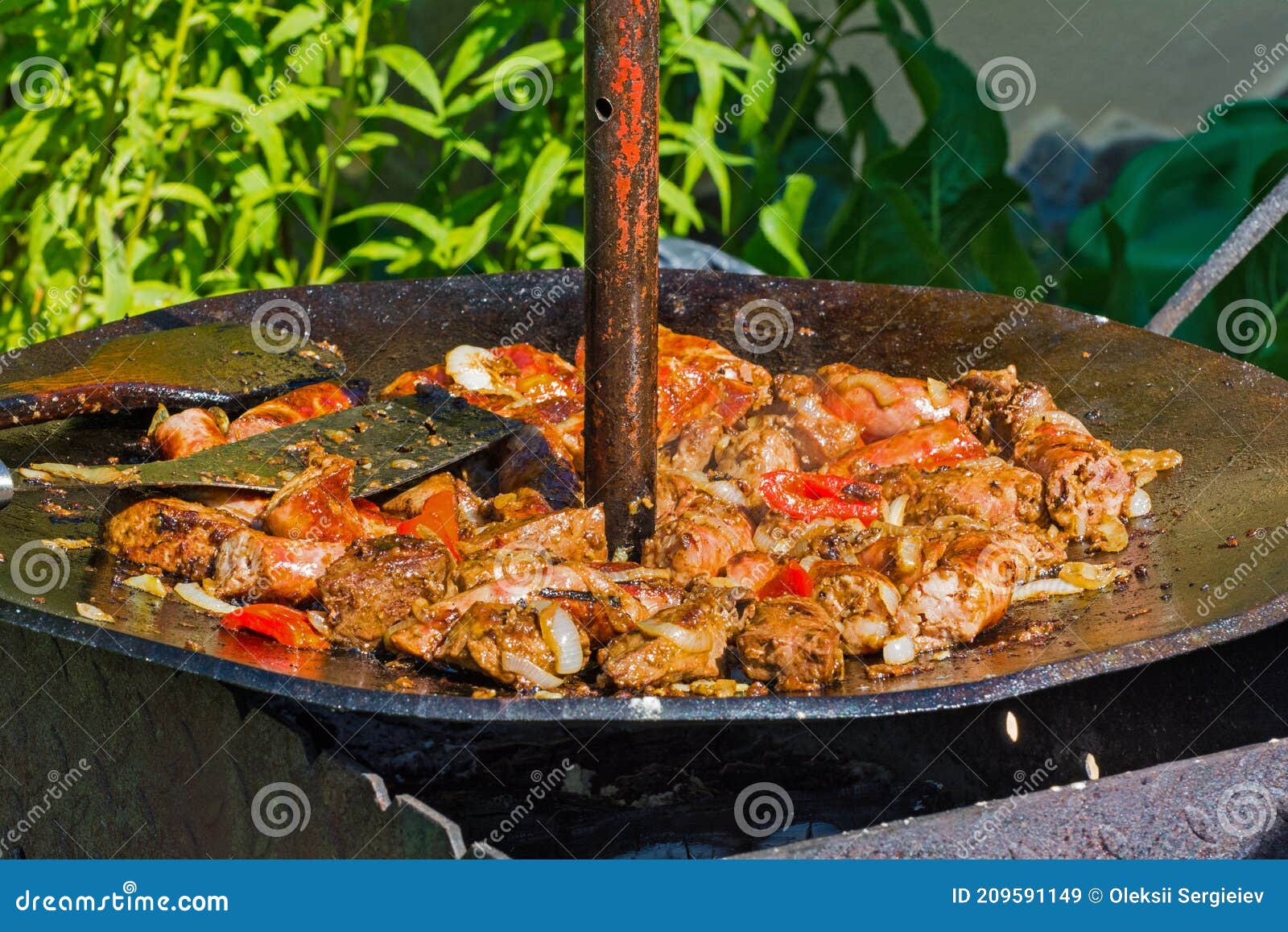 The meat in a cauldron stock image. Image of burn, barbecue - 209591149