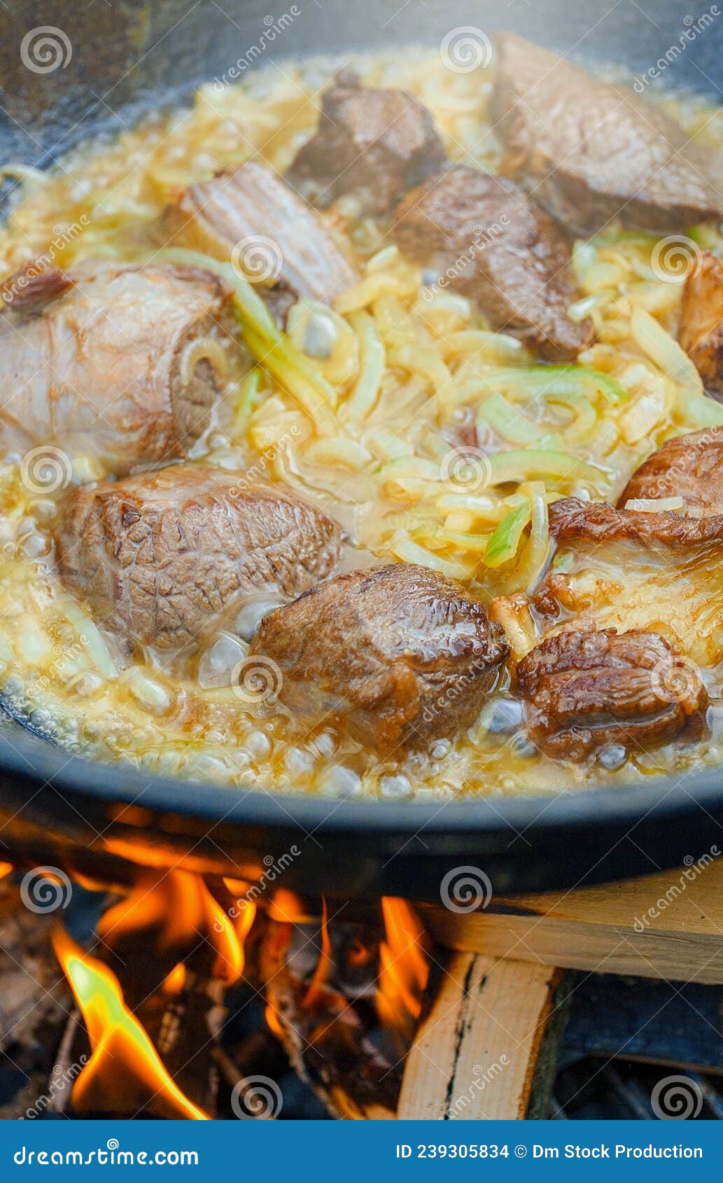Meat is Cooked in Cauldron on Fire. Stock Photo - Image of meat, fire ...