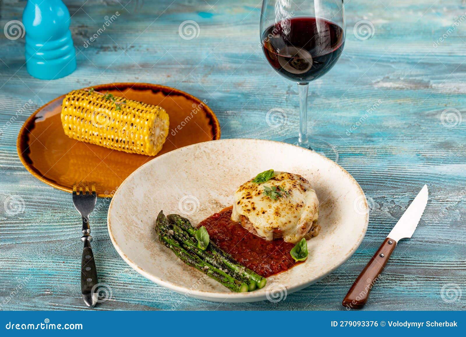 Meat Cutlet Under Cheese with Asparagus and Grilled Corn Stock Photo ...