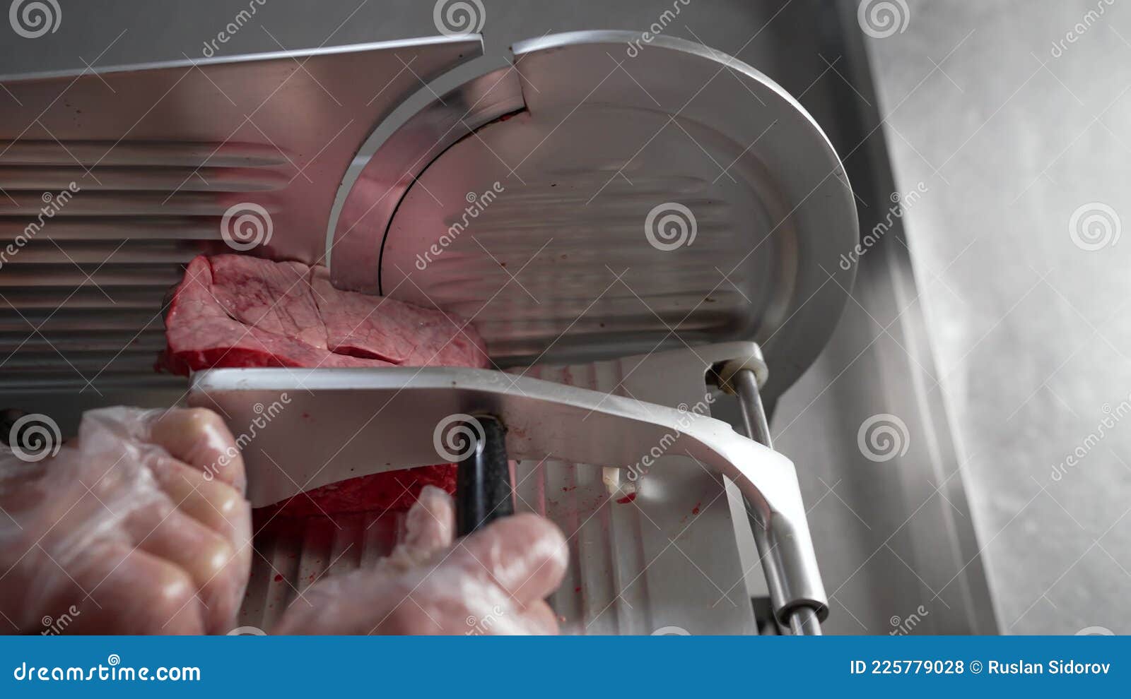 Meat Cutting Slicing Machine in Food Processing Factory. Meat is Cut on ...