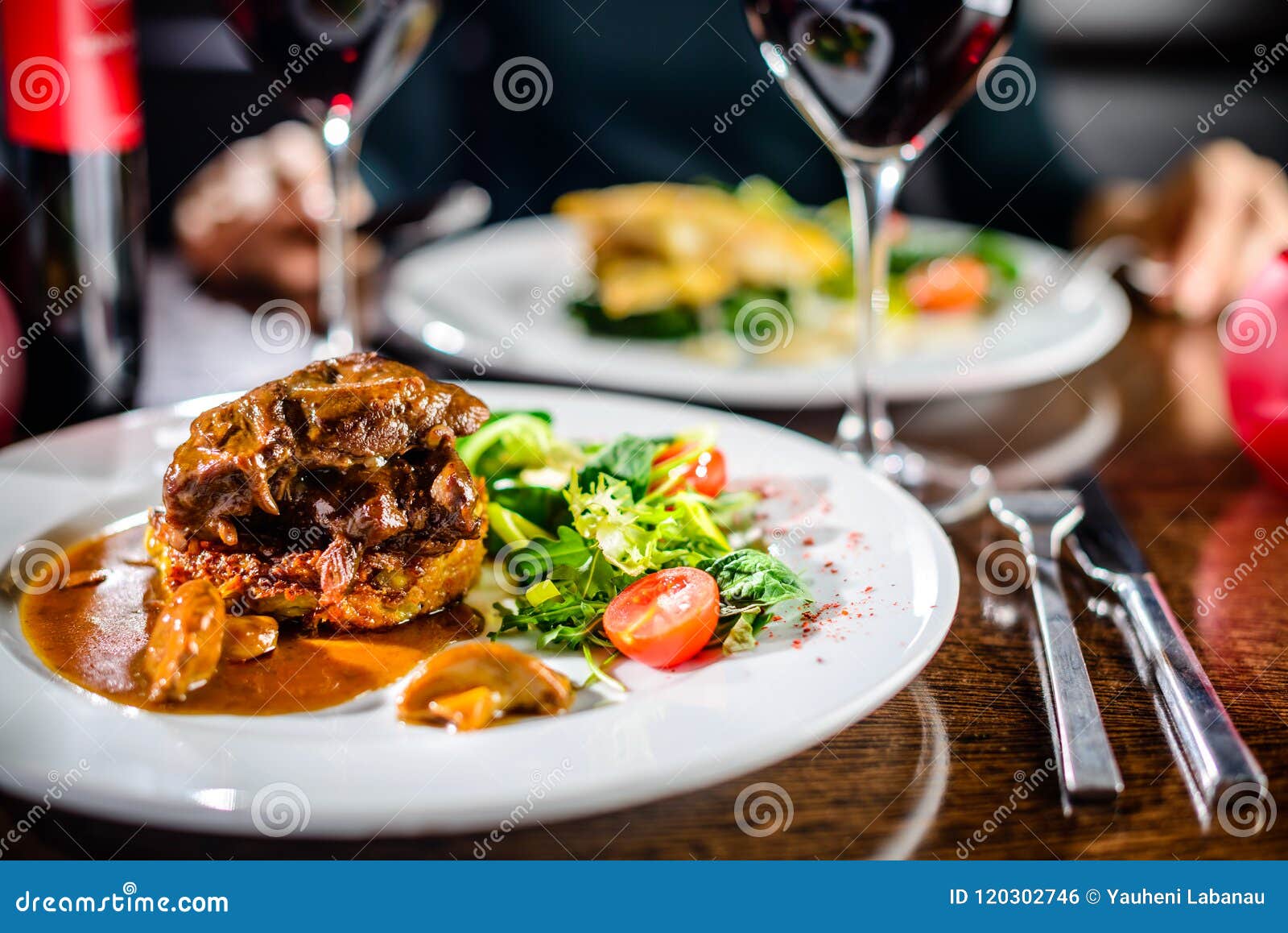 Meat Dish. Appetizing Beef Cheeks in Sauce with Tomatoes and Bas Stock ...