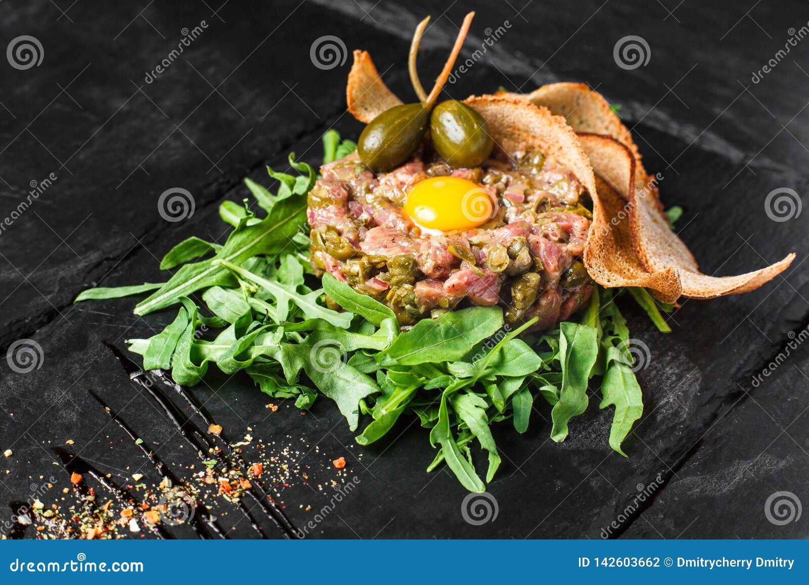 Meat Dish Tar Tar from Beef with Vegetables, Fresh Herbs and Quail Eggs ...