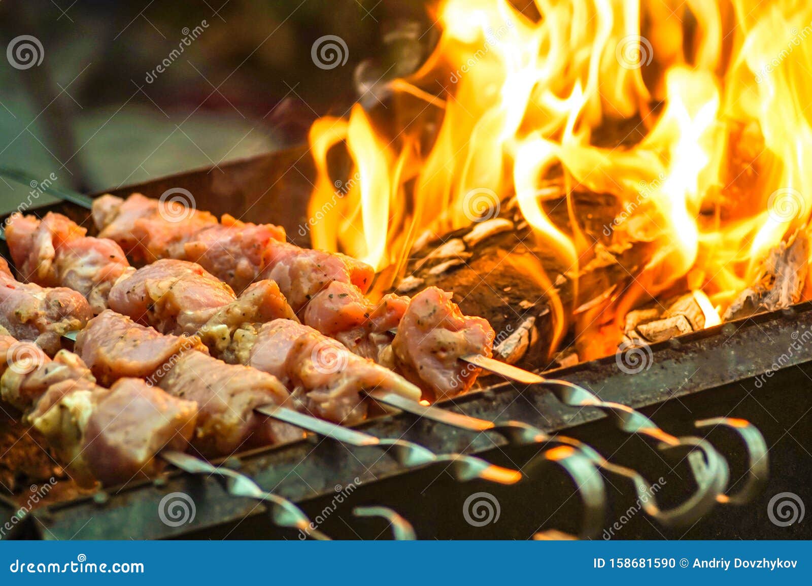The Meat is Fried Over an Open Fire, a Weekend Barbecue. Flame Outdoors ...