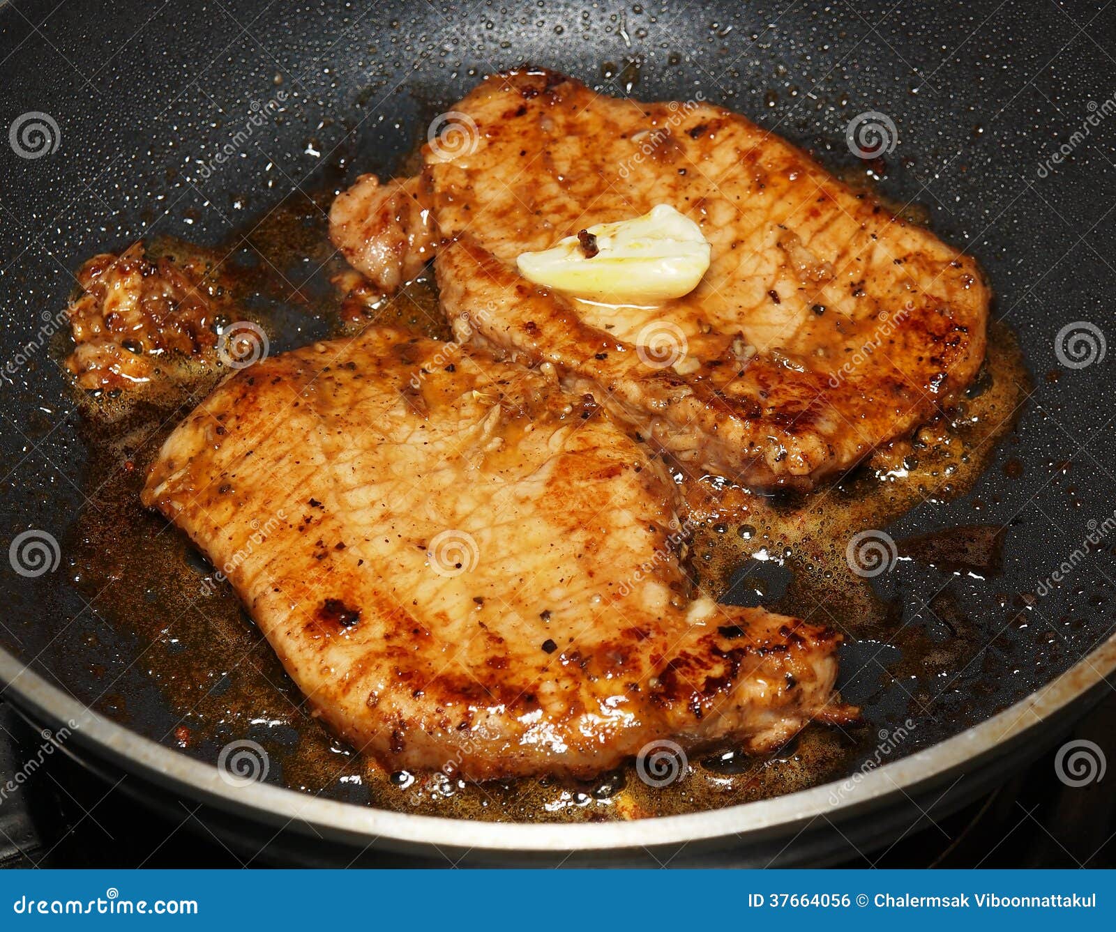 Meat frying in a pan stock photo. Image of delicious - 37664056