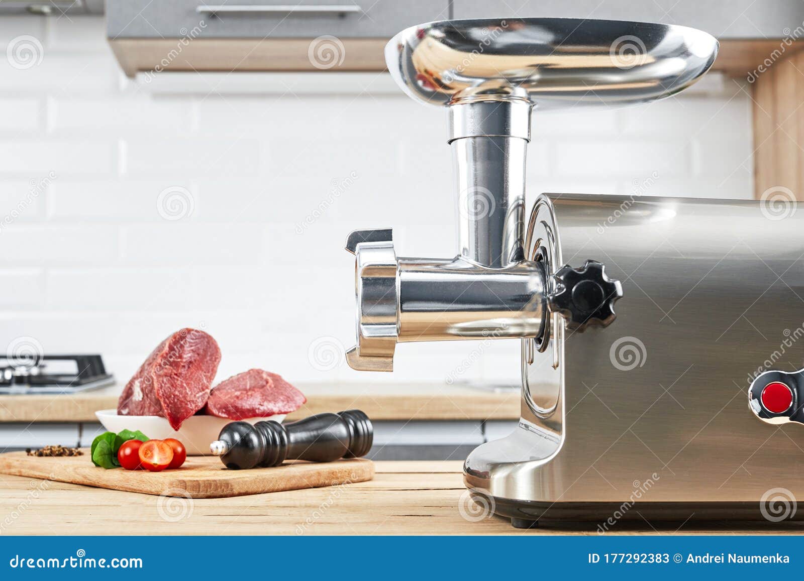 Meat Grinder with Fresh Meat on a Wooden Table in Kitchen Interior ...