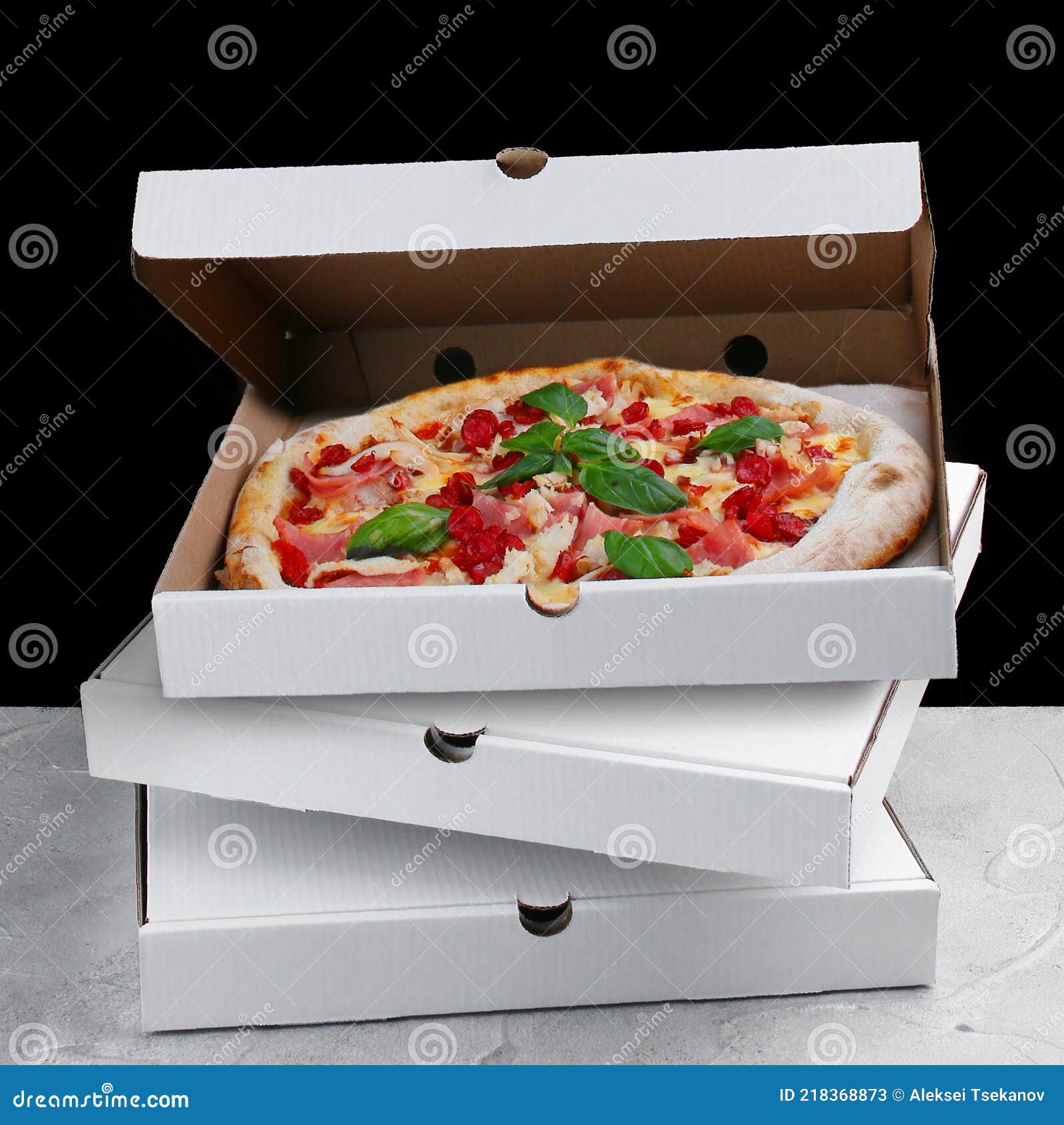 Meat Pizza Inside Box. Stack of Pizza Boxes Standing on Concrete Table ...