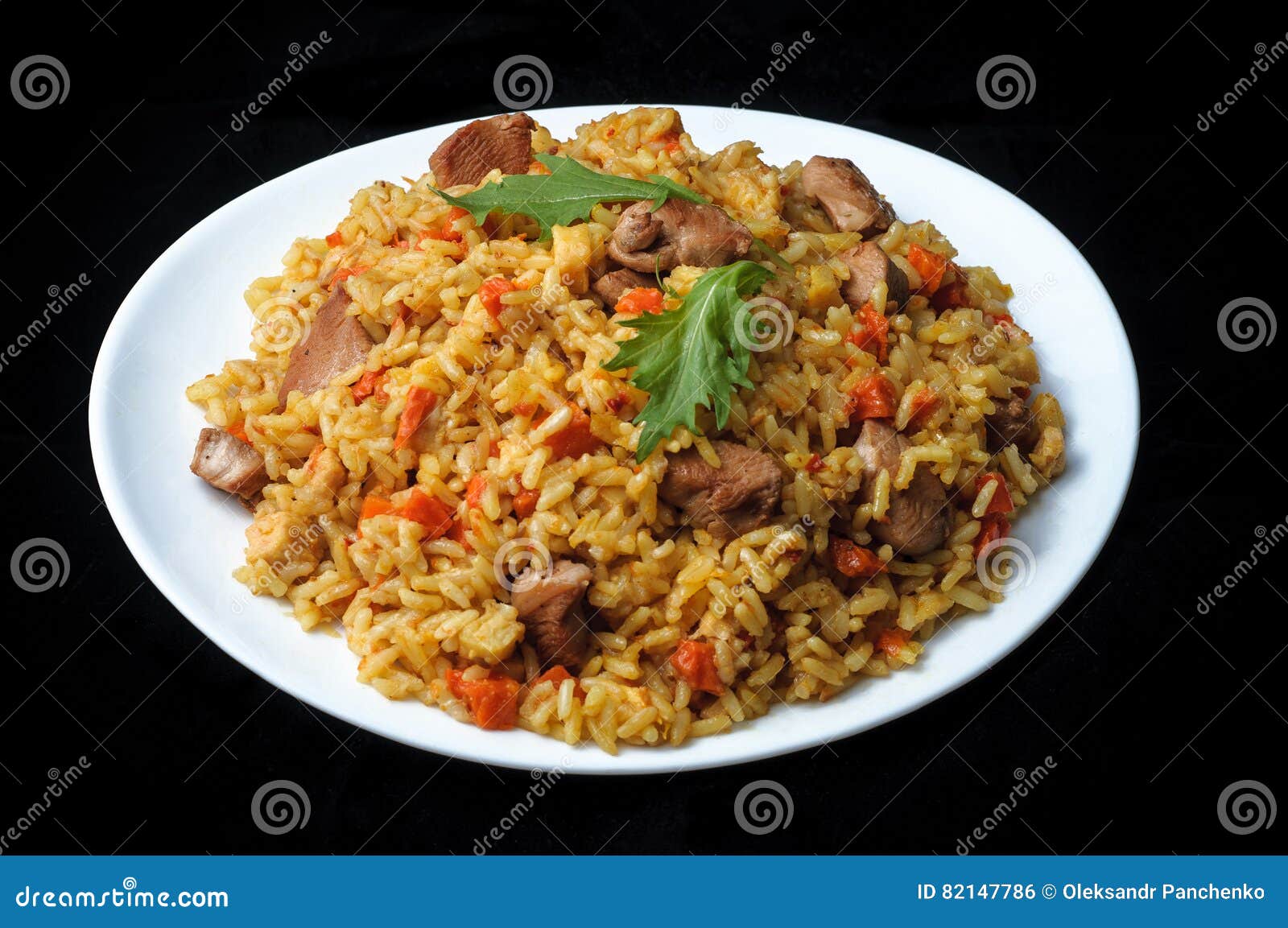 Meat with Rice and Vegetables in White Plate Isolated on Black Stock ...