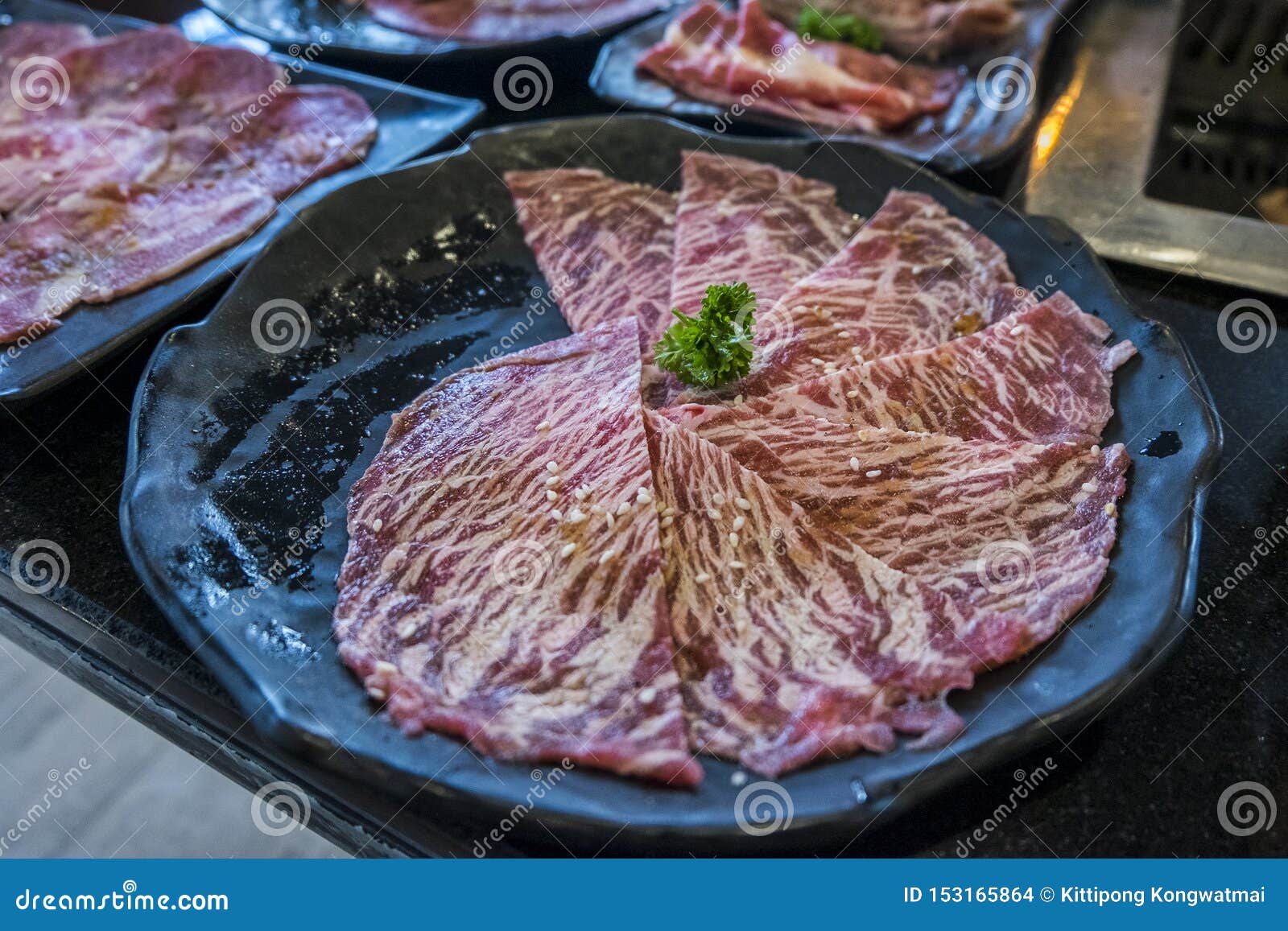 Various Cuts of Raw Meat Shot from Above on a Cast Iron Grill Stock ...