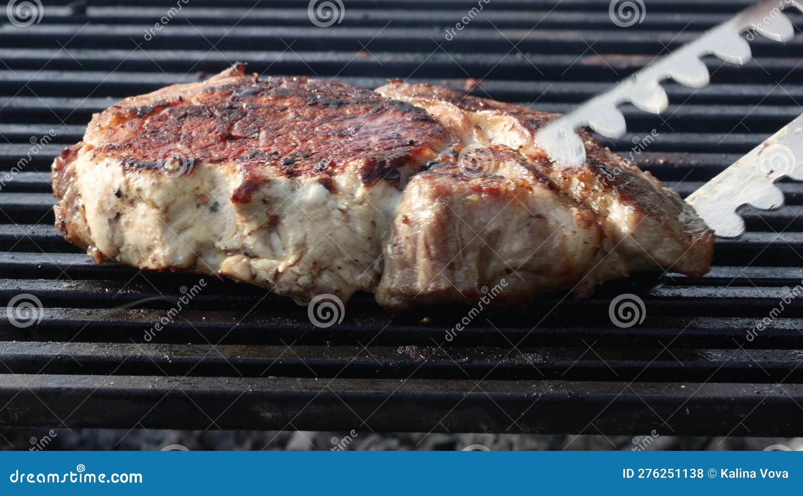 A Meat Steak Fried on a Wire Rack with Smoke and Fire Stock Photo ...