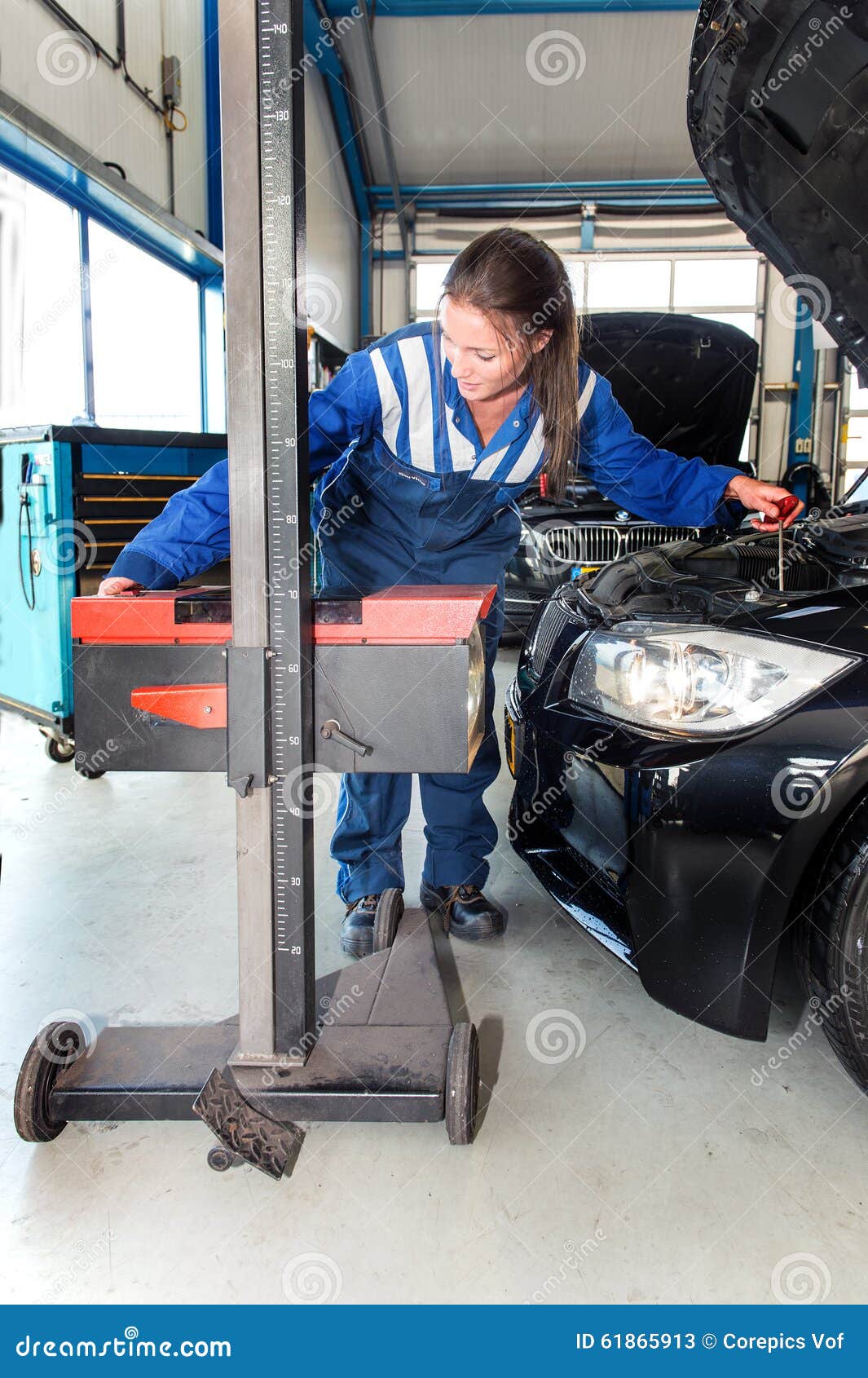 Mechanic, Adjusting the Hight of a Car S Head Lights Stock Image ...