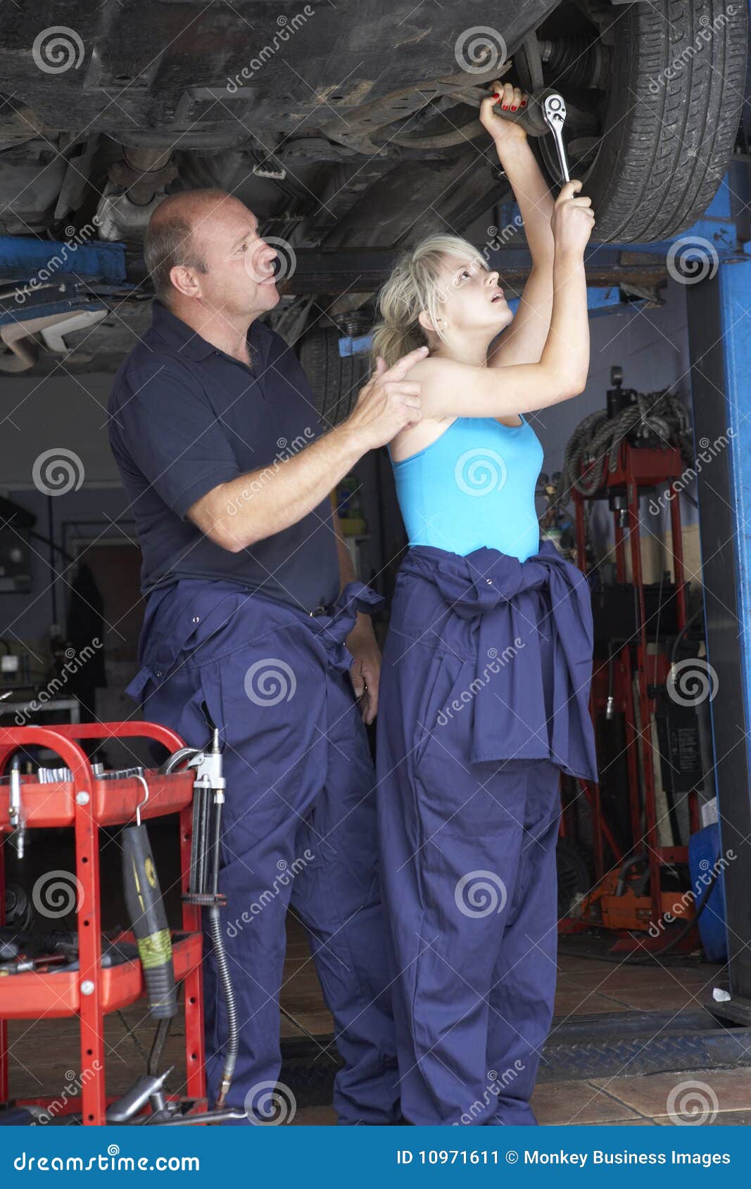 Mechanic and Apprentice Working on Car Stock Image - Image of employed ...