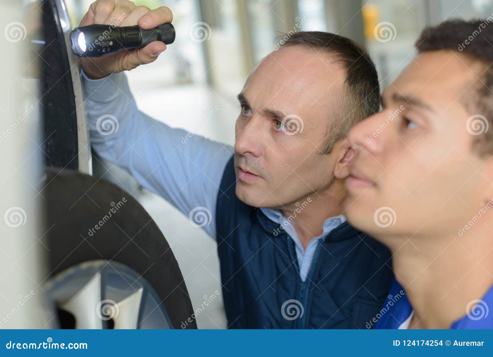 Mechanic and Apprentice Working on Car Together Stock Photo - Image of ...