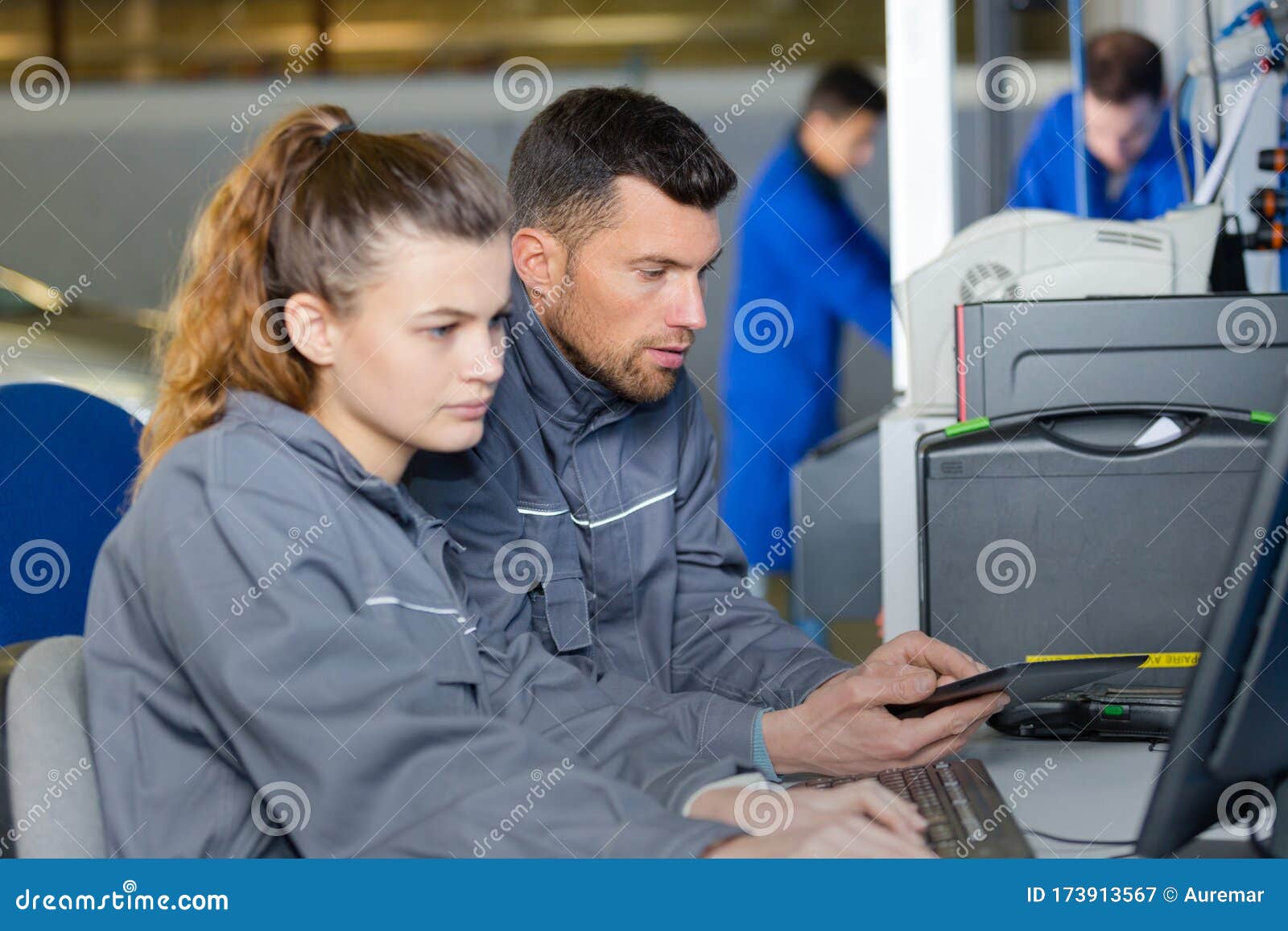 Mechanic and Apprentice Working on Computer Stock Image - Image of male ...