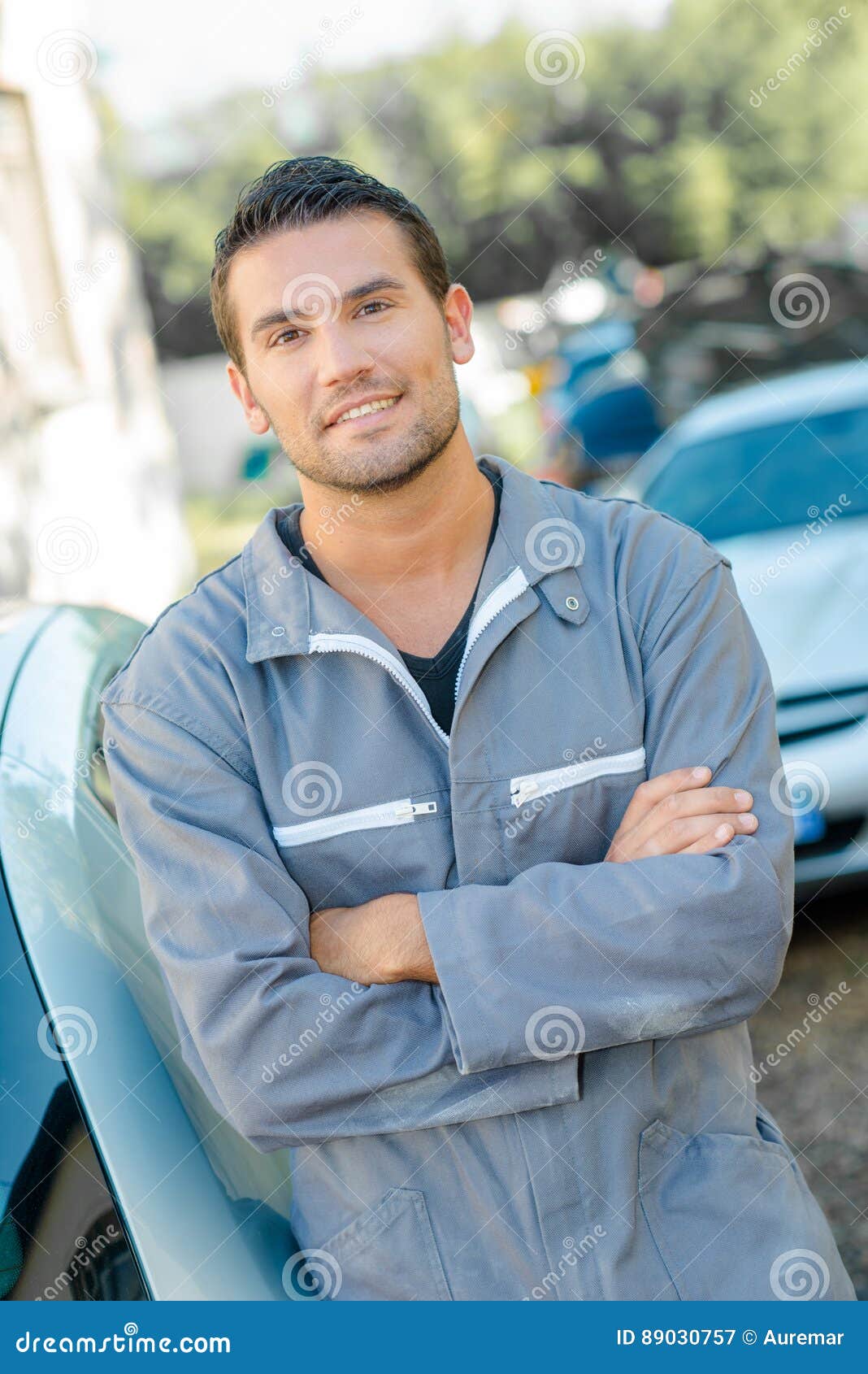 Mechanic with arms folded stock image. Image of adult - 89030757