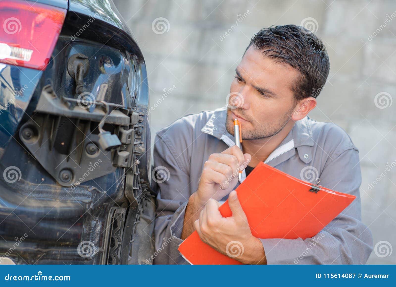 Mechanic assessing a car stock image. Image of professional - 115614087