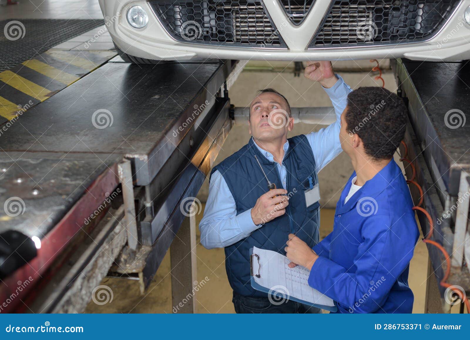 Mechanic and Assistant Checking Car Stock Image - Image of engine ...