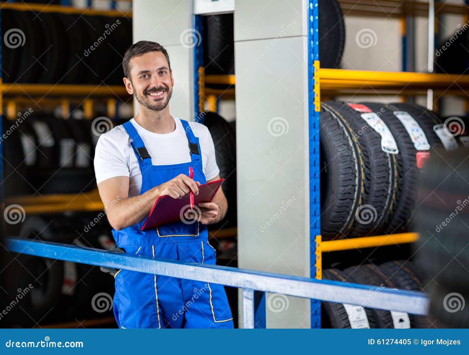 Mechanic in Blue Uniform Holding a Clipboard Stock Image - Image of ...
