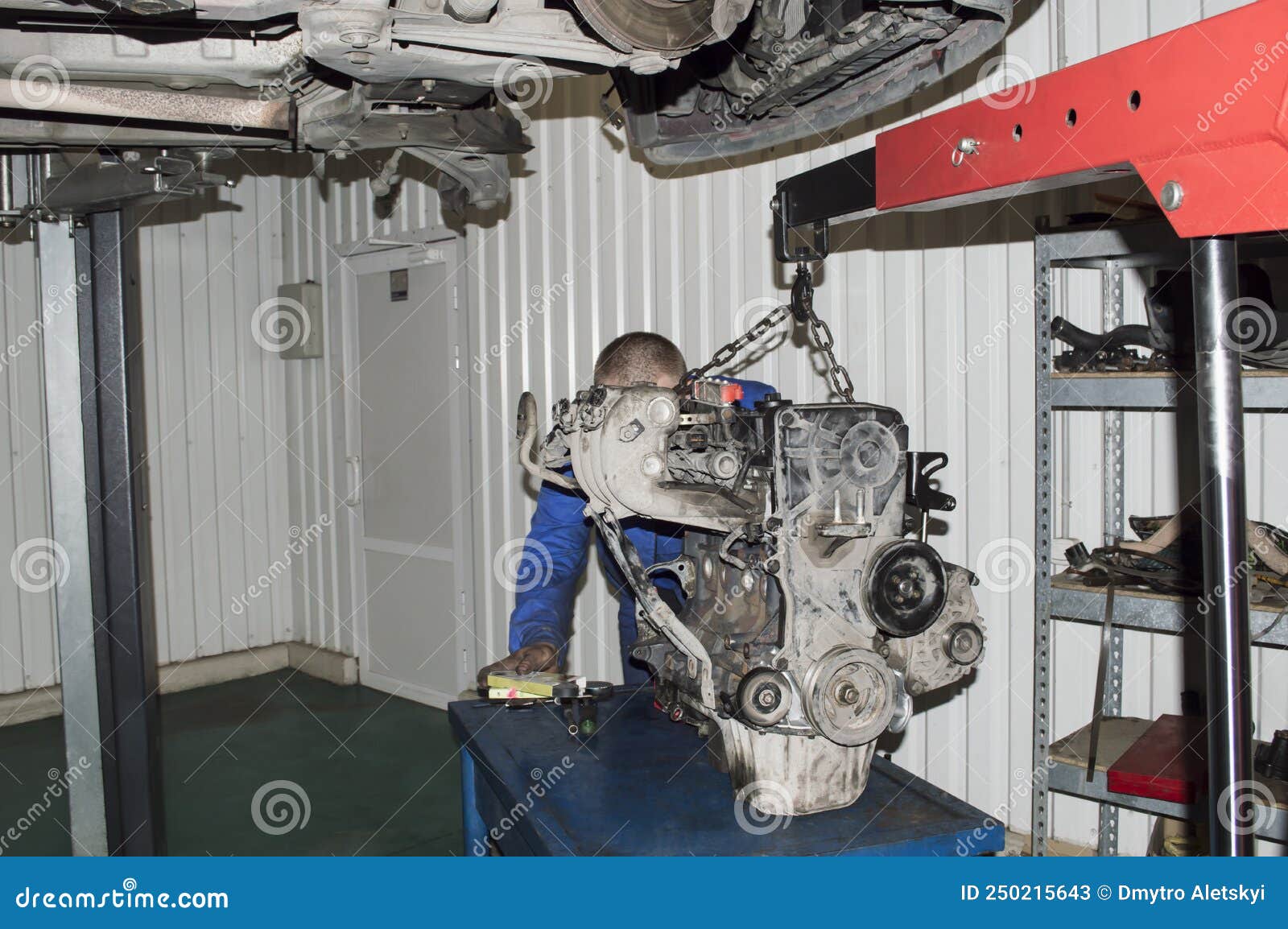 The Mechanic Prepares the Car Engine for Installation on the Car Stock ...