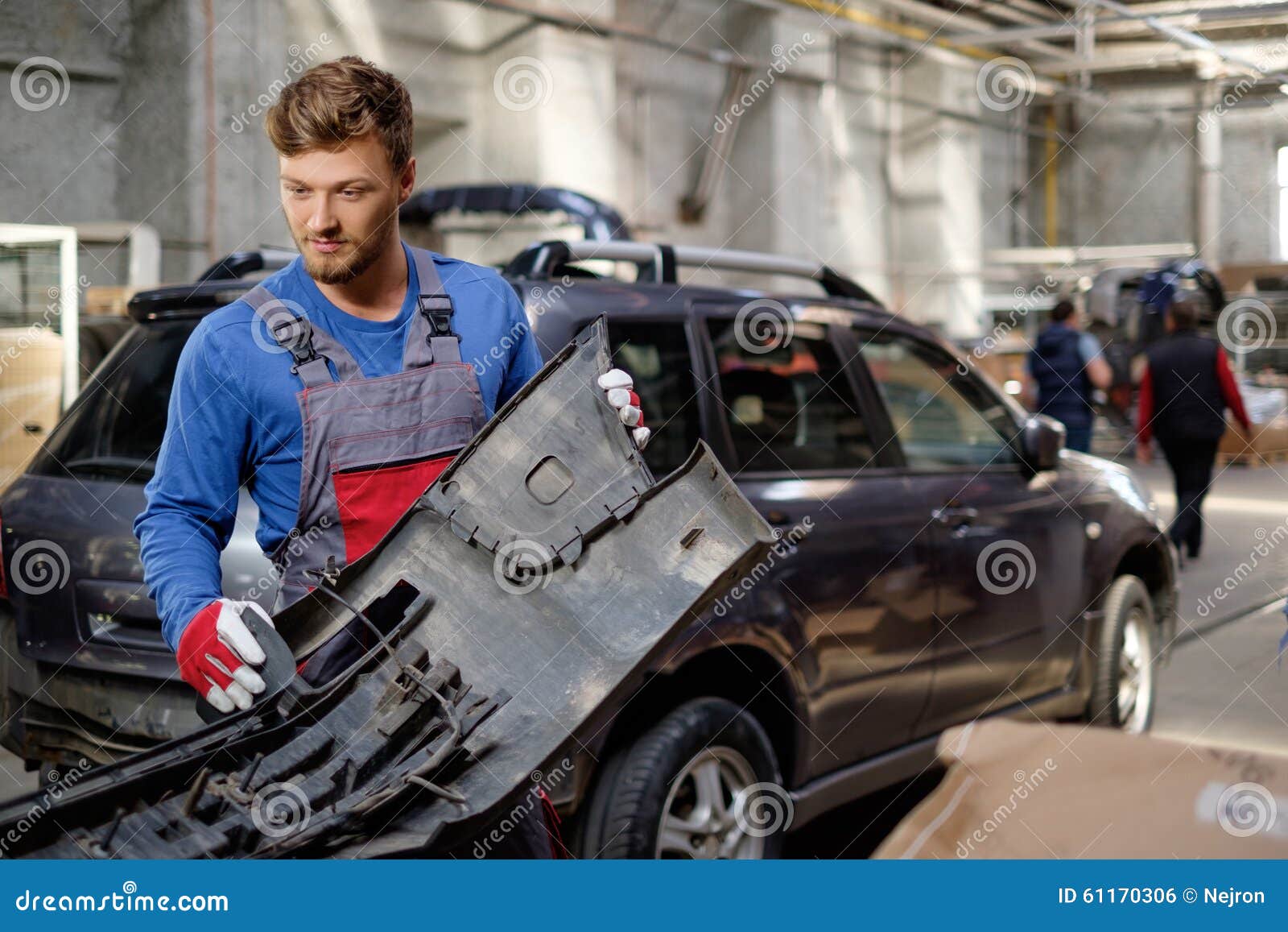 Mechanic with car bumper stock photo. Image of inspection - 61170306