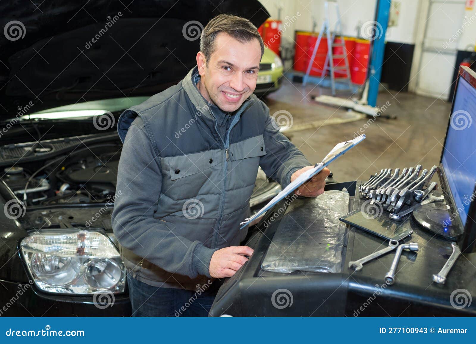 Mechanic at Car at Workshop Stock Image - Image of auto, vehicle: 277100943
