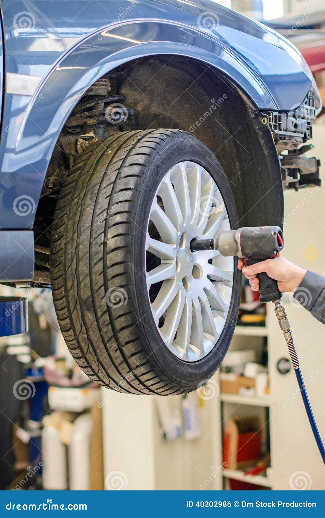 Mechanic Changing Car Wheel. Stock Photo - Image of pneumatic ...
