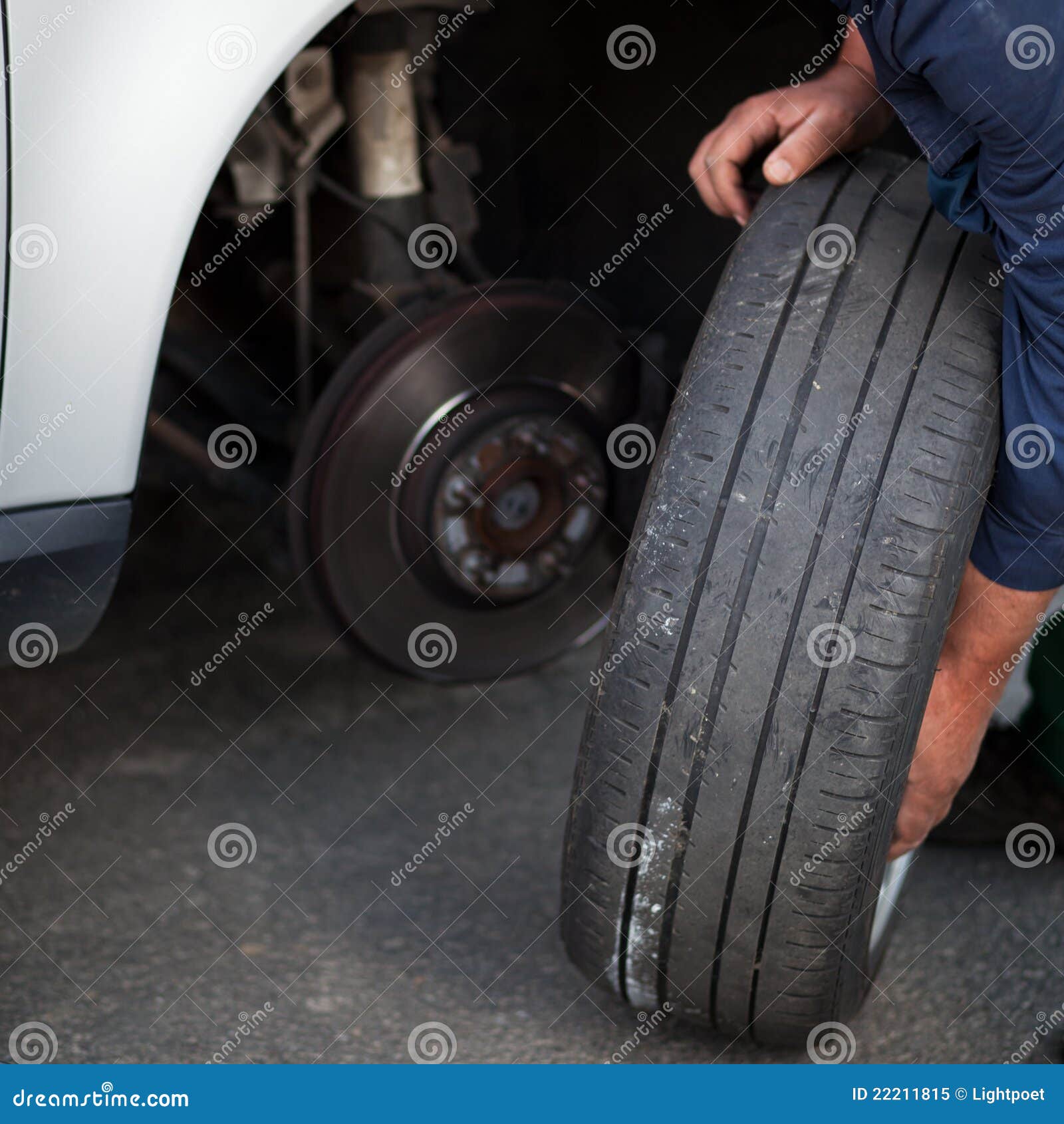 Mechanic Changing a Wheel of a Modern Car Stock Image - Image of ...