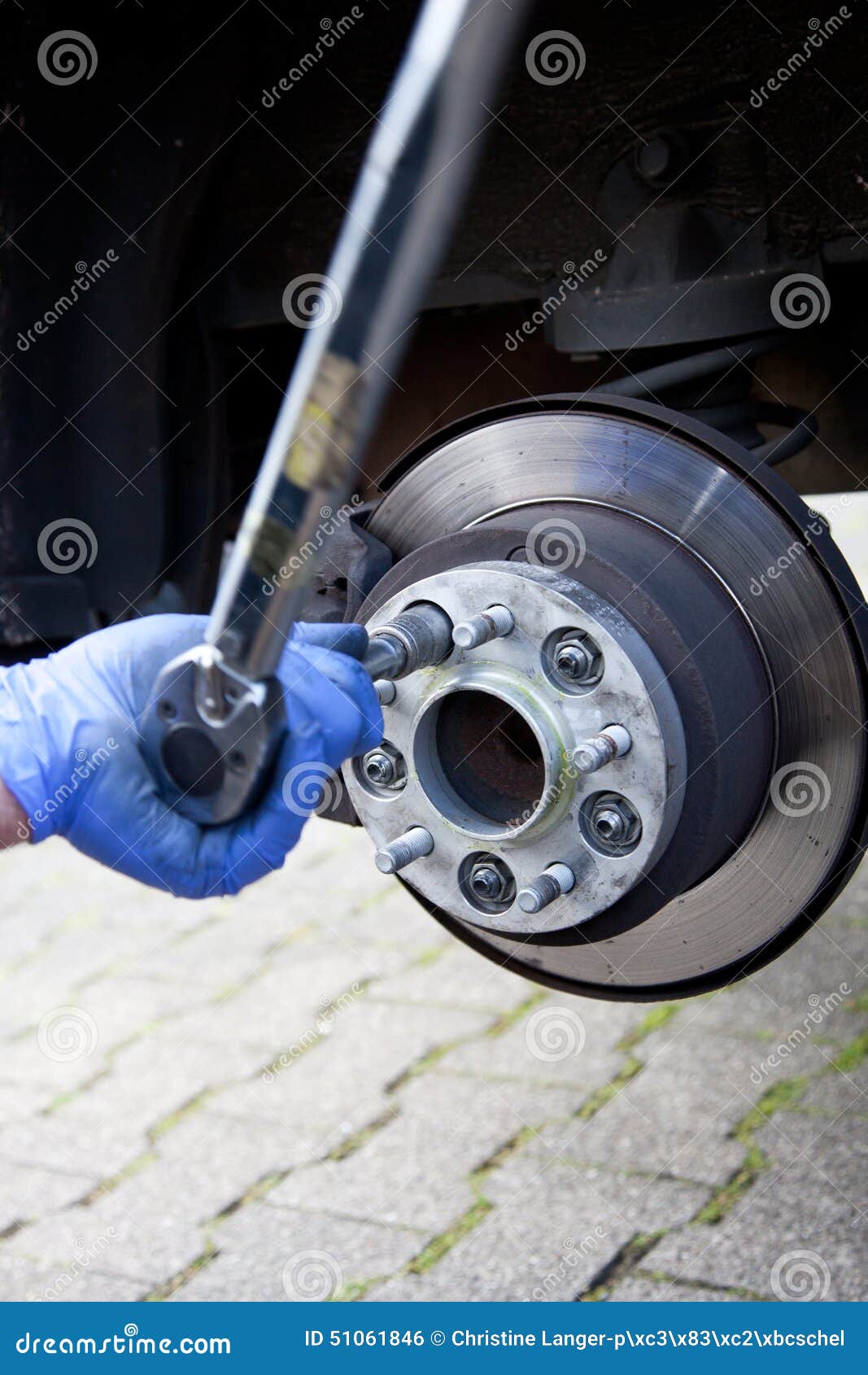 Mechanic changing a wheel stock photo. Image of person - 51061846