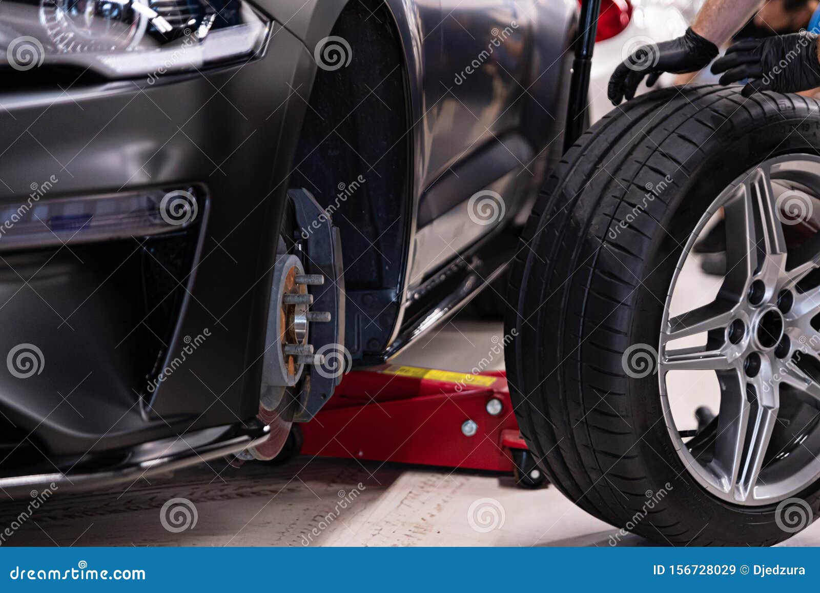 Mechanic Changing Wheel and Tire. Car Service Stock Image - Image of ...