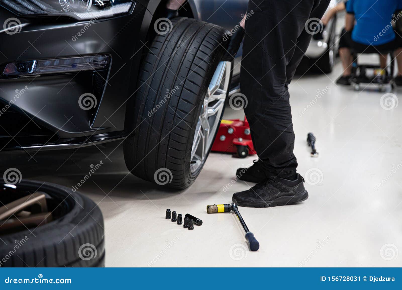 Mechanic Changing Wheel and Tire. Car Service Stock Image - Image of ...
