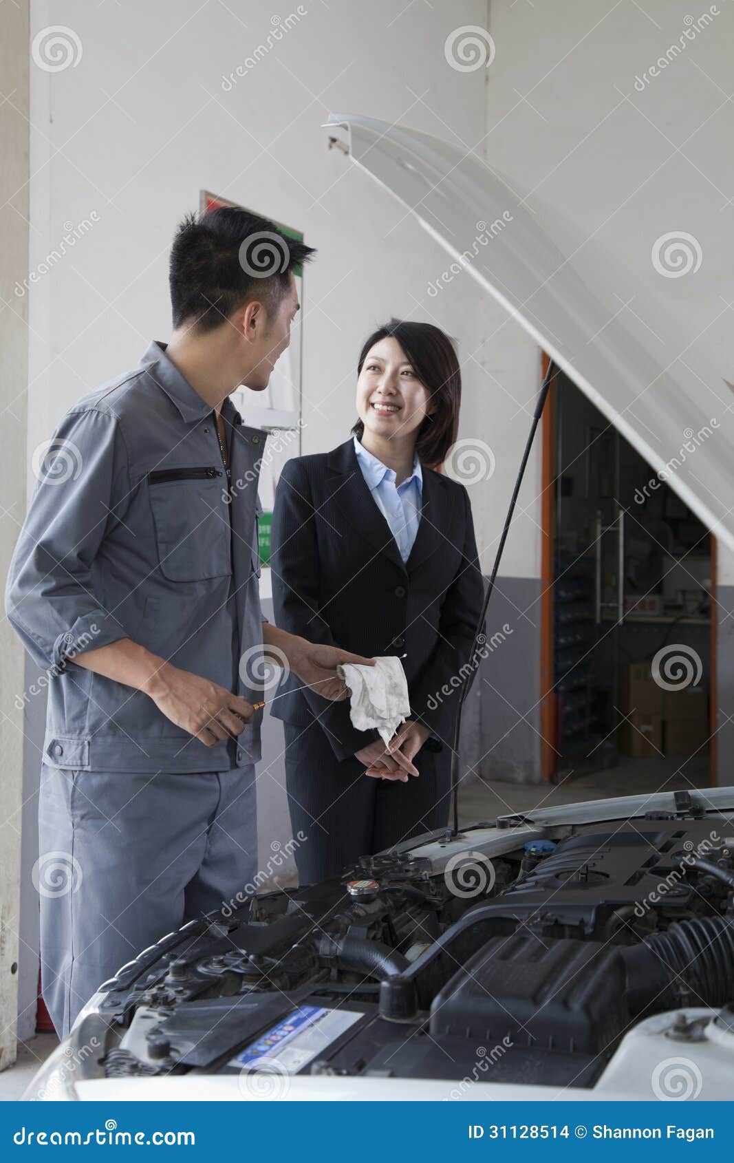 Mechanic Chatting and Laughing with Customer Stock Photo - Image of ...