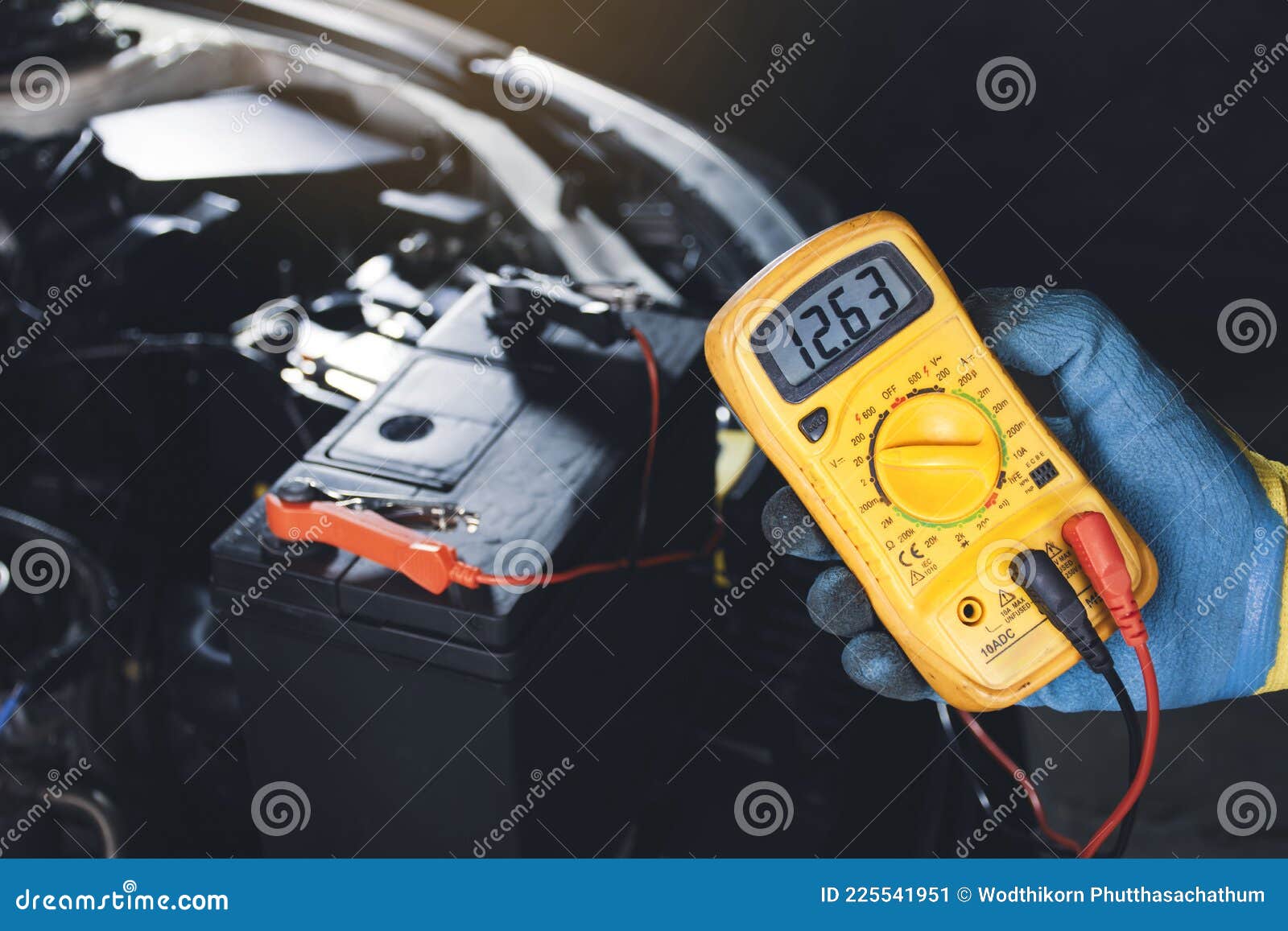 Technician Checking Car Battery Voltage with Digital Multimeter Stock ...