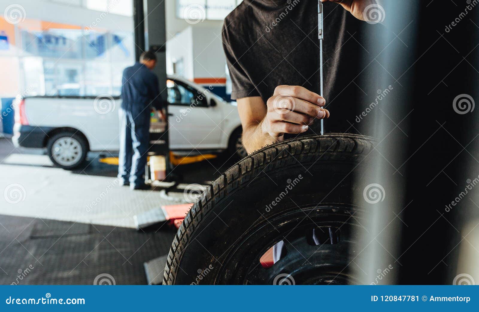 Mechanic Checking Car Tire Tread Depth Stock Image - Image of problems ... Mechanic Checking Car Tire Tread Depth Stock Image - Image of problems ...