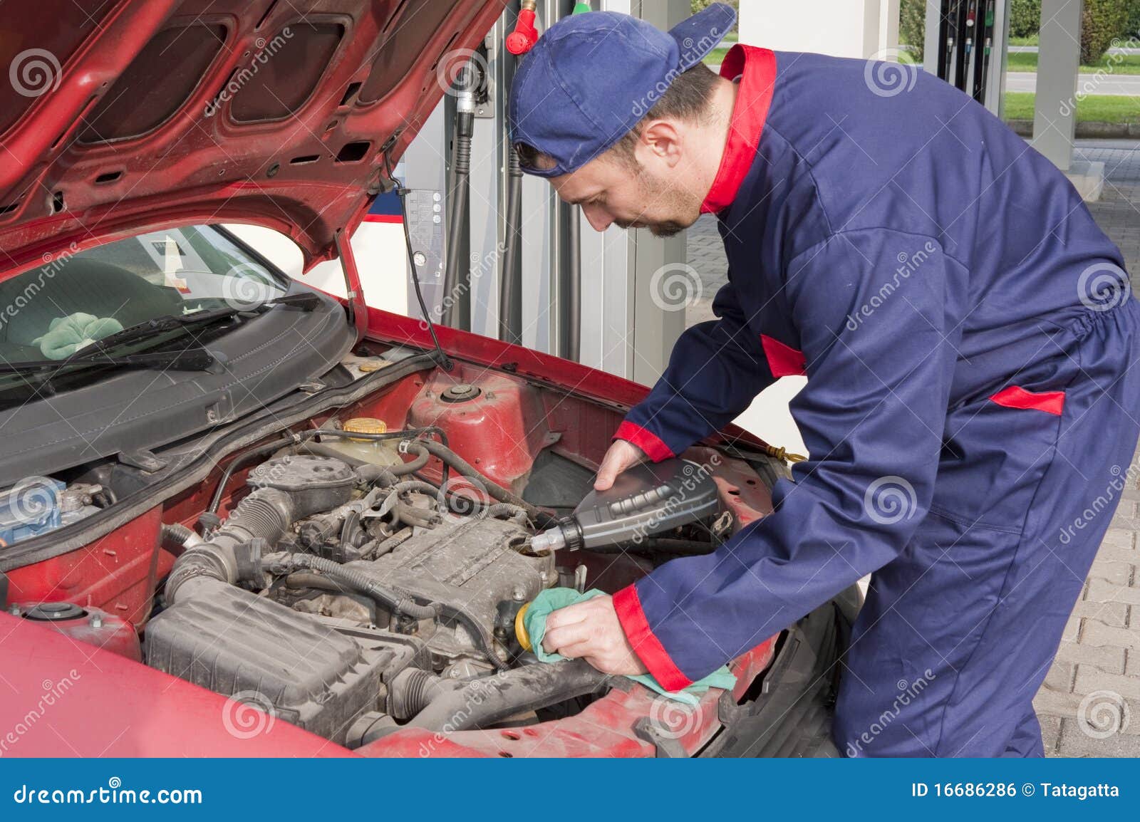 Mechanic Checking Engine stock photo. Image of station - 16686286