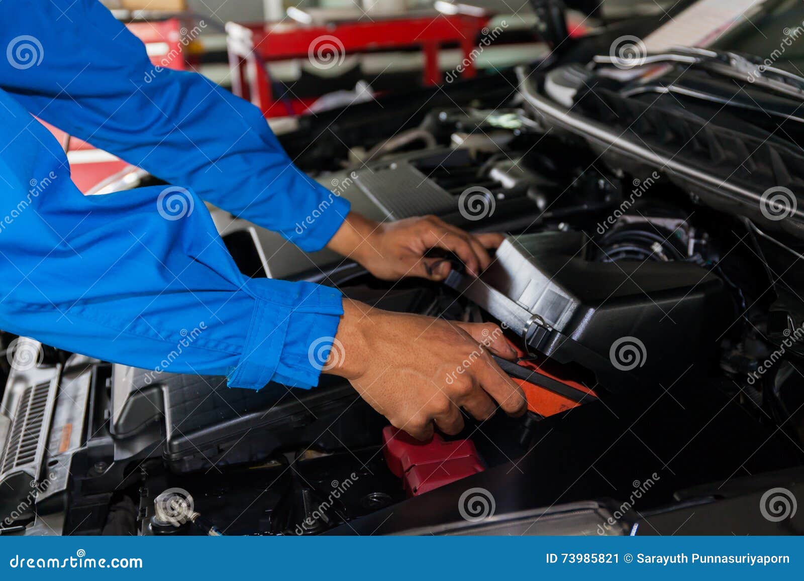 Mechanic Checking and Fixing a Broken Car in Car Service Garage Stock ...