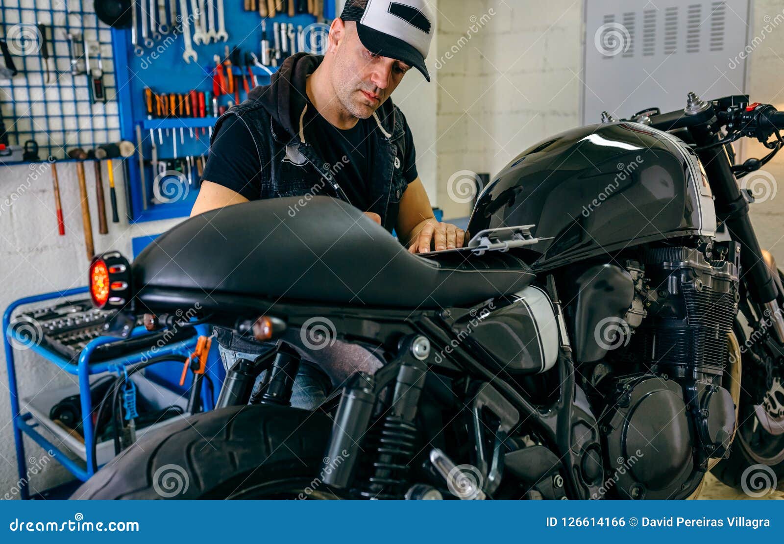 Mechanic Checking Motorcycle Stock Photo - Image of checking, bike ...