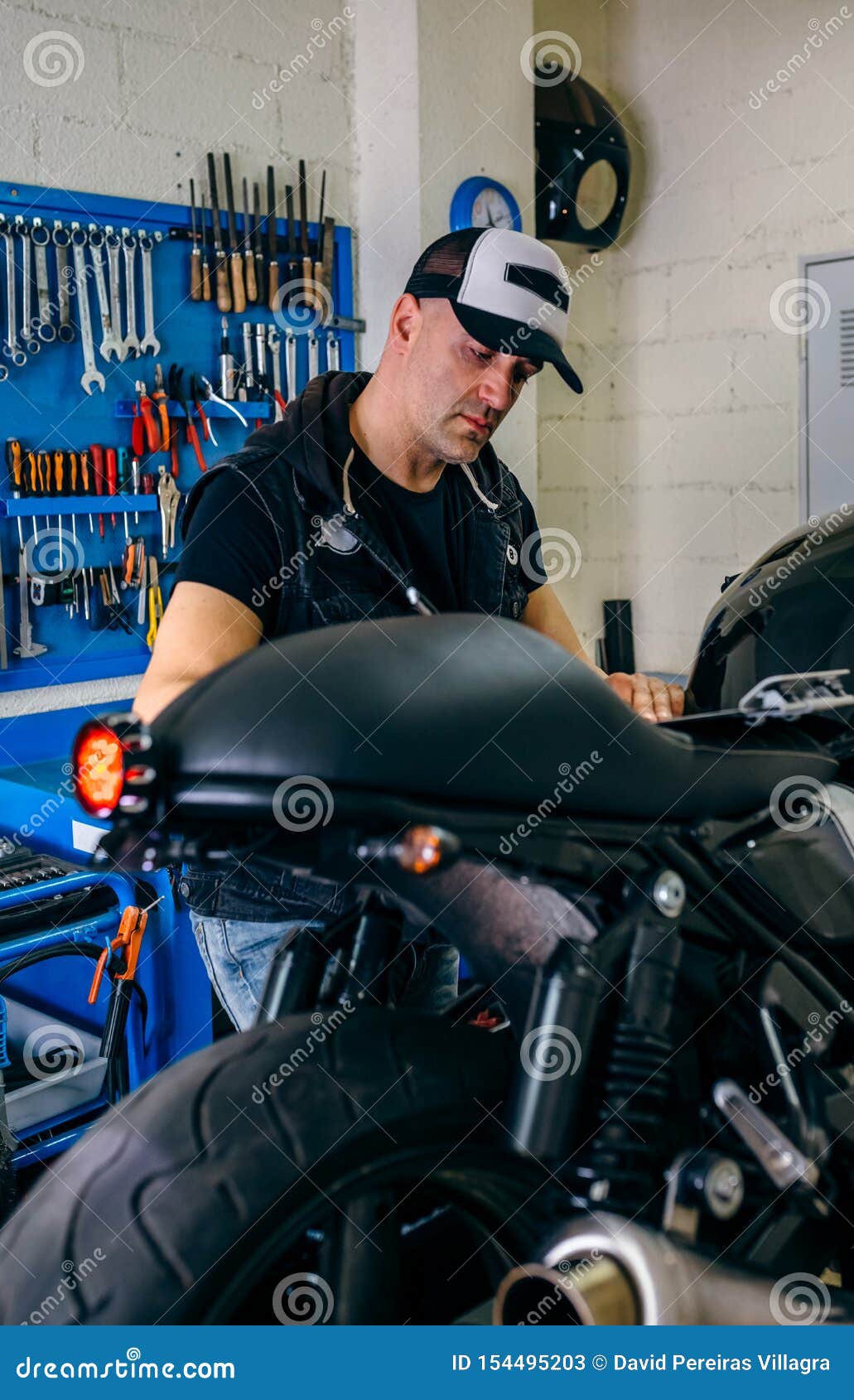 Mechanic Checking Motorcycle Stock Image - Image of handmade, real ...